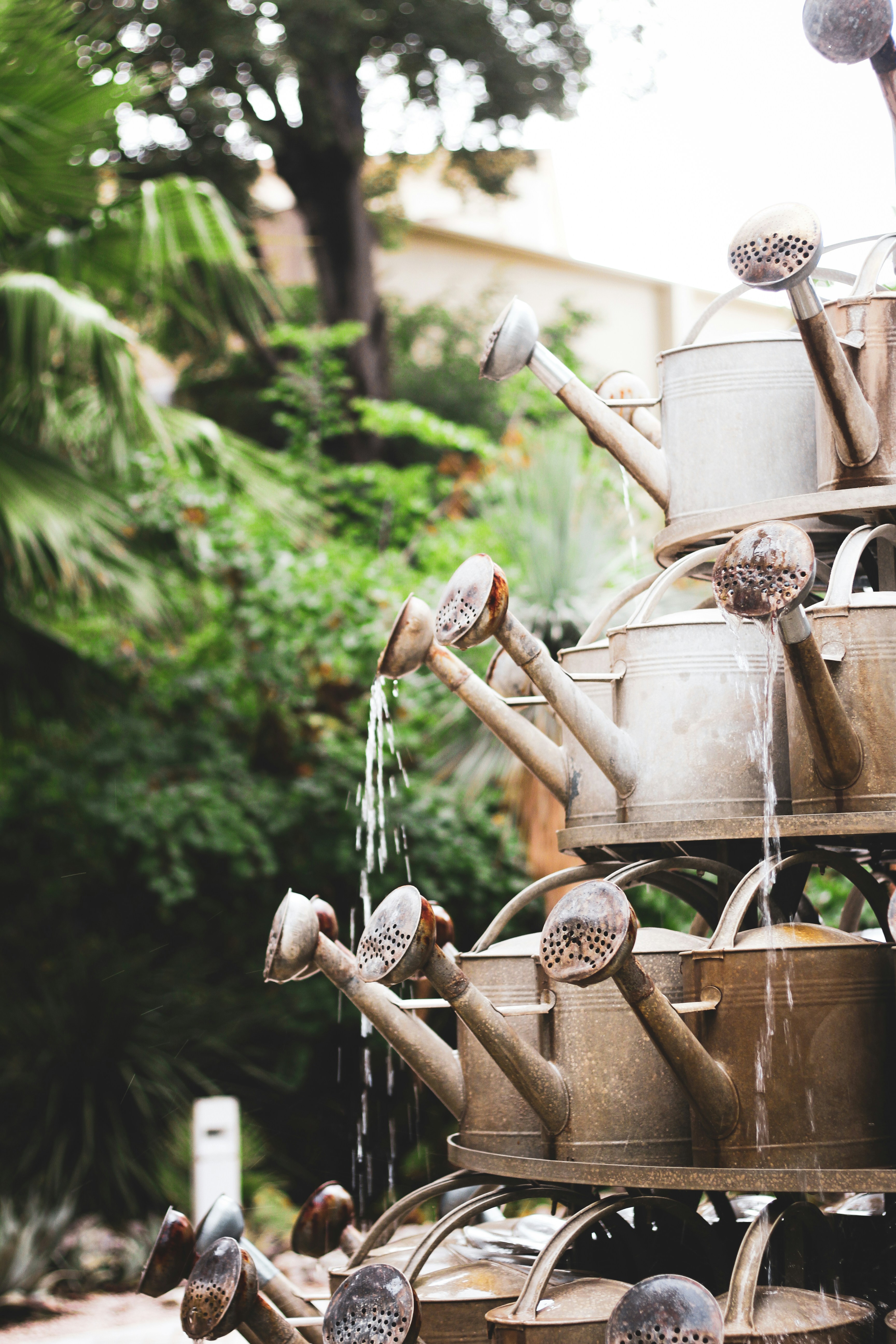 Watering a Garden: A Tiered Metal Sprinkler Cascade