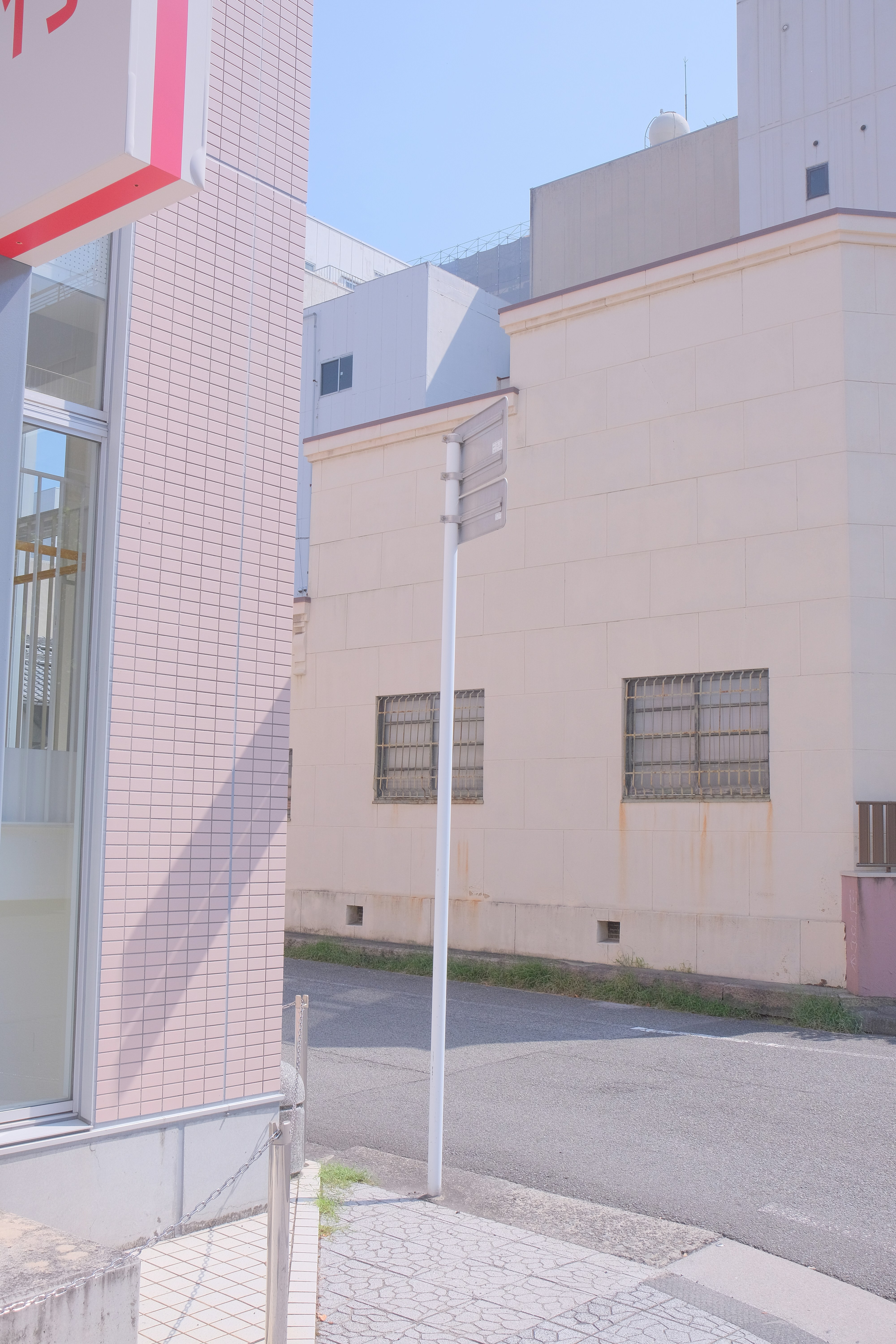 Pale buildings and street on a clear day