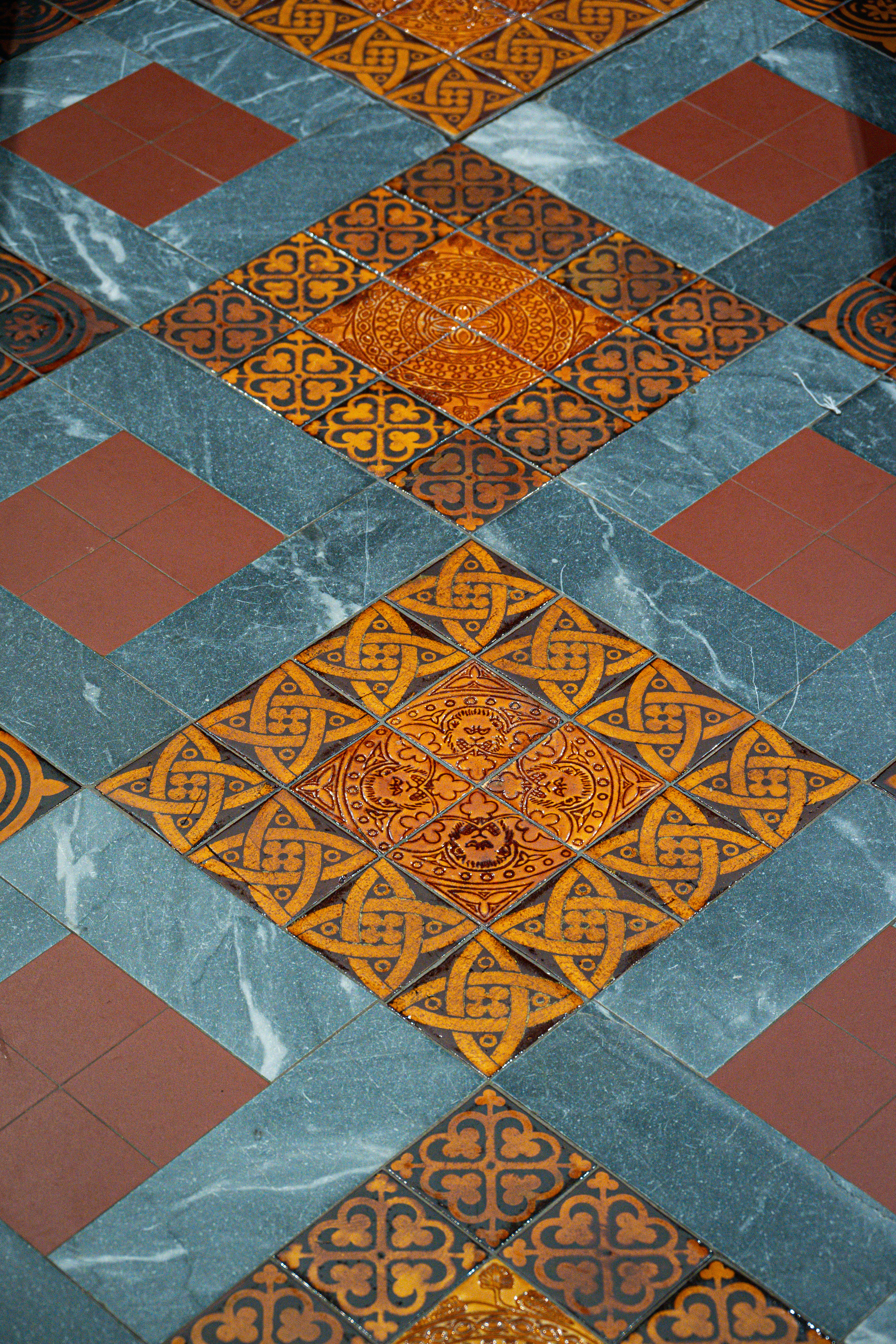 Intricate geometric patterned floor with diamond shapes.