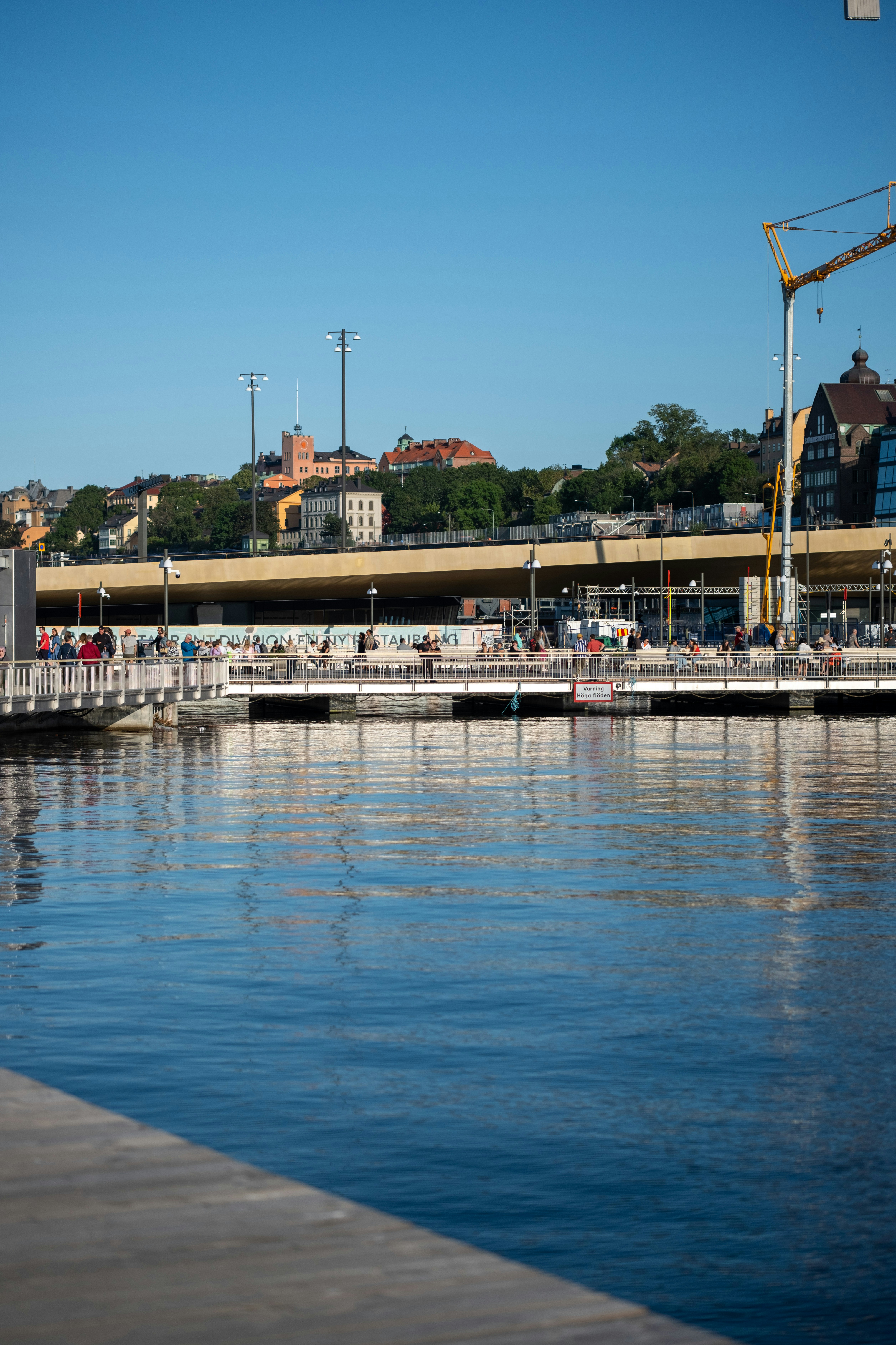City skyline with a bridge and calm water