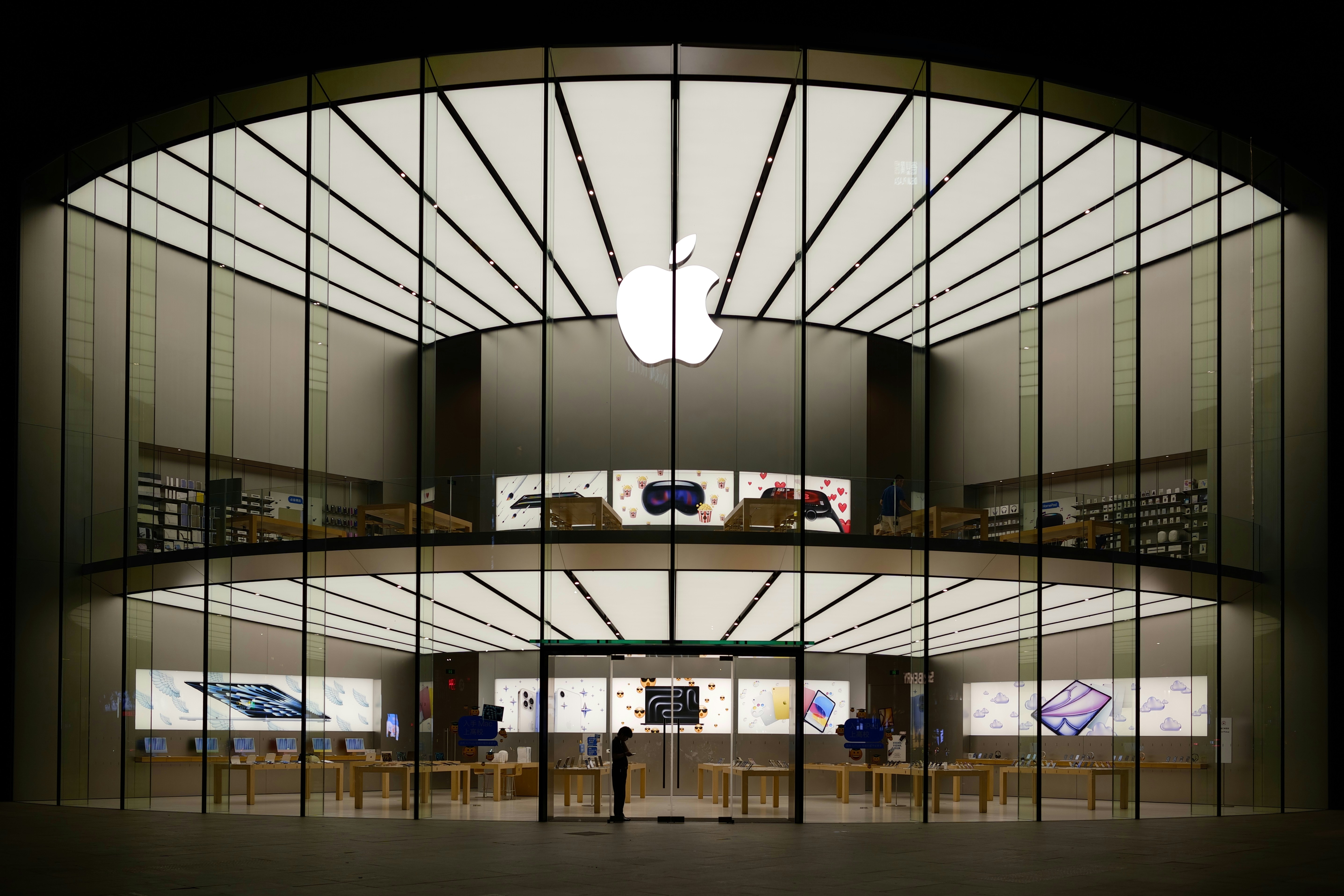 Modern apple store with illuminated logo at night photo – Free Building ...
