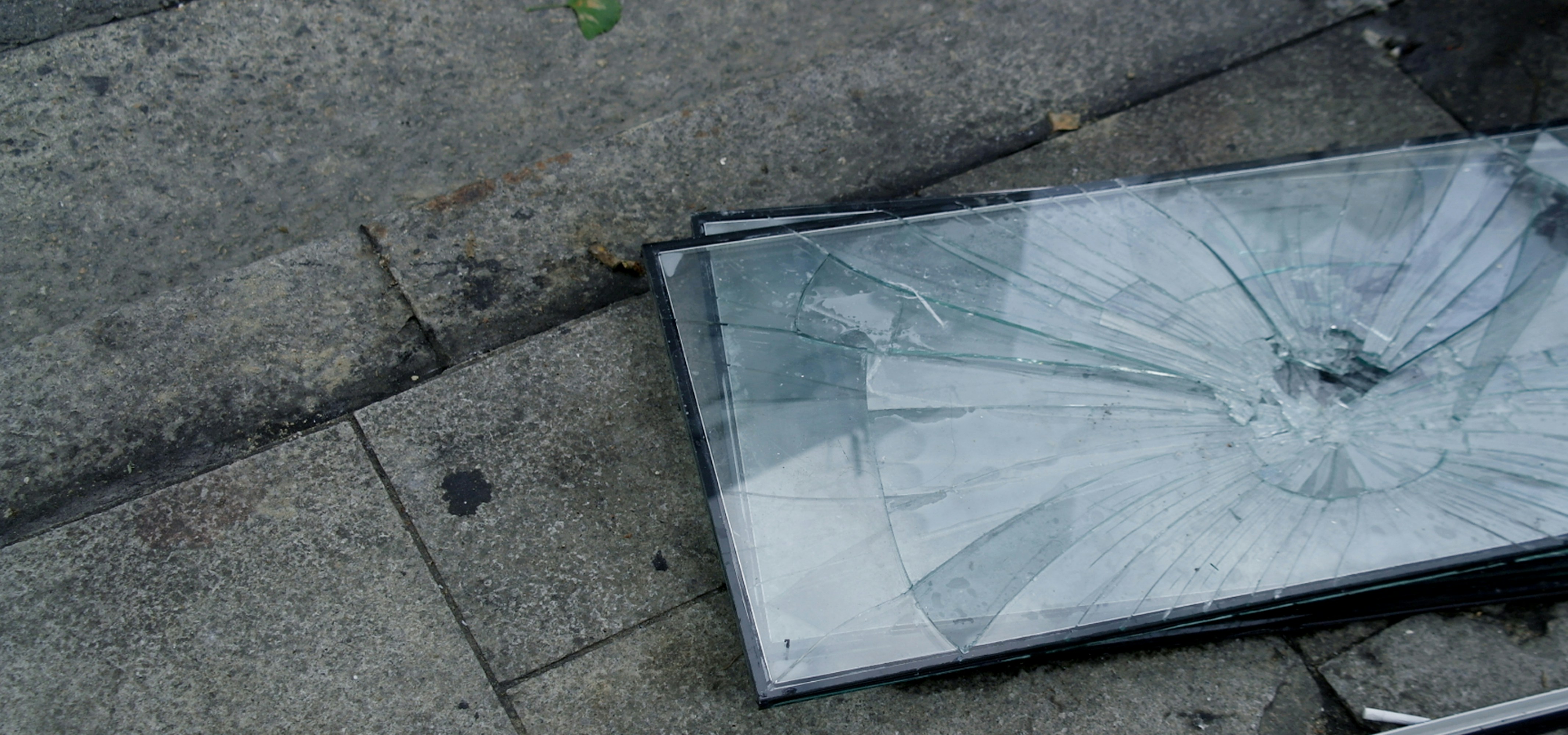 Broken glass on concrete steps