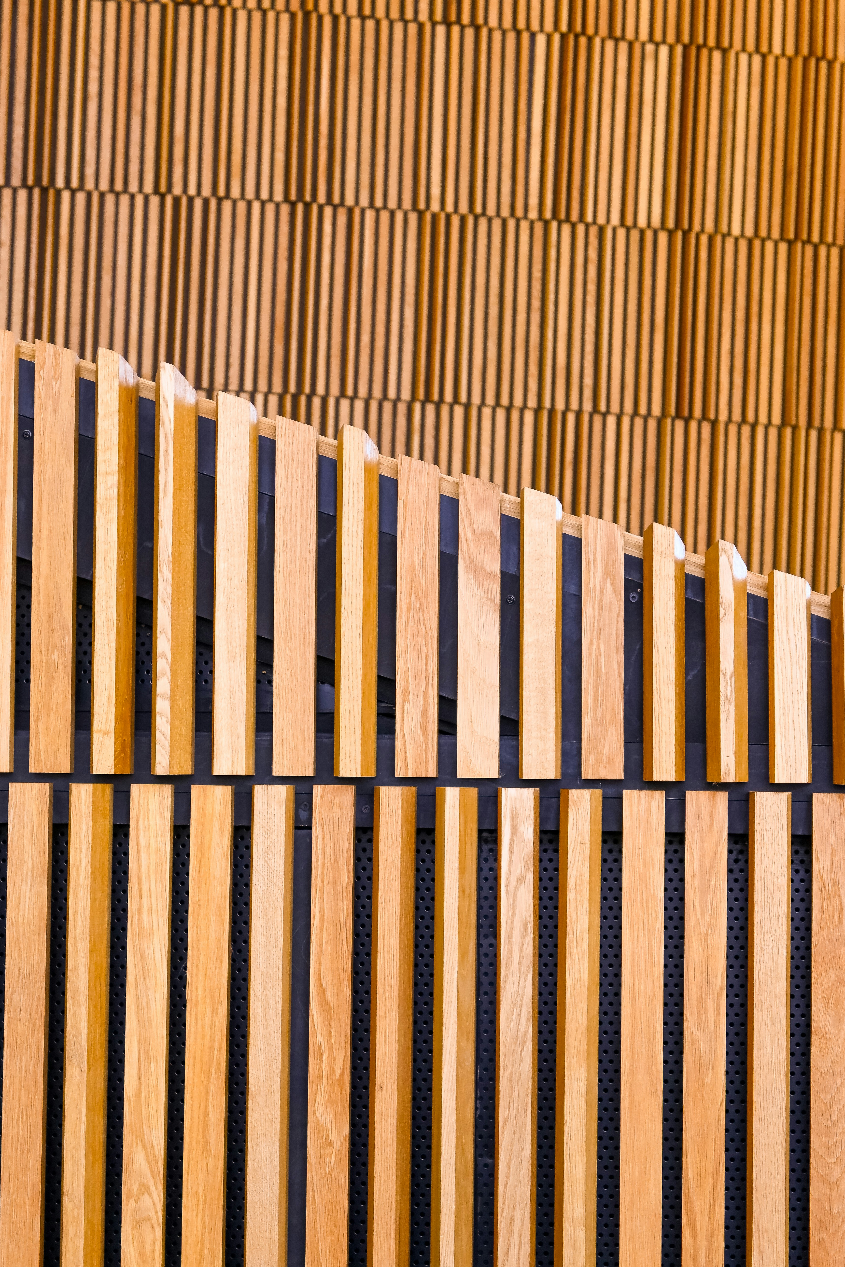 Wooden slats arranged in a rhythmic pattern on wall