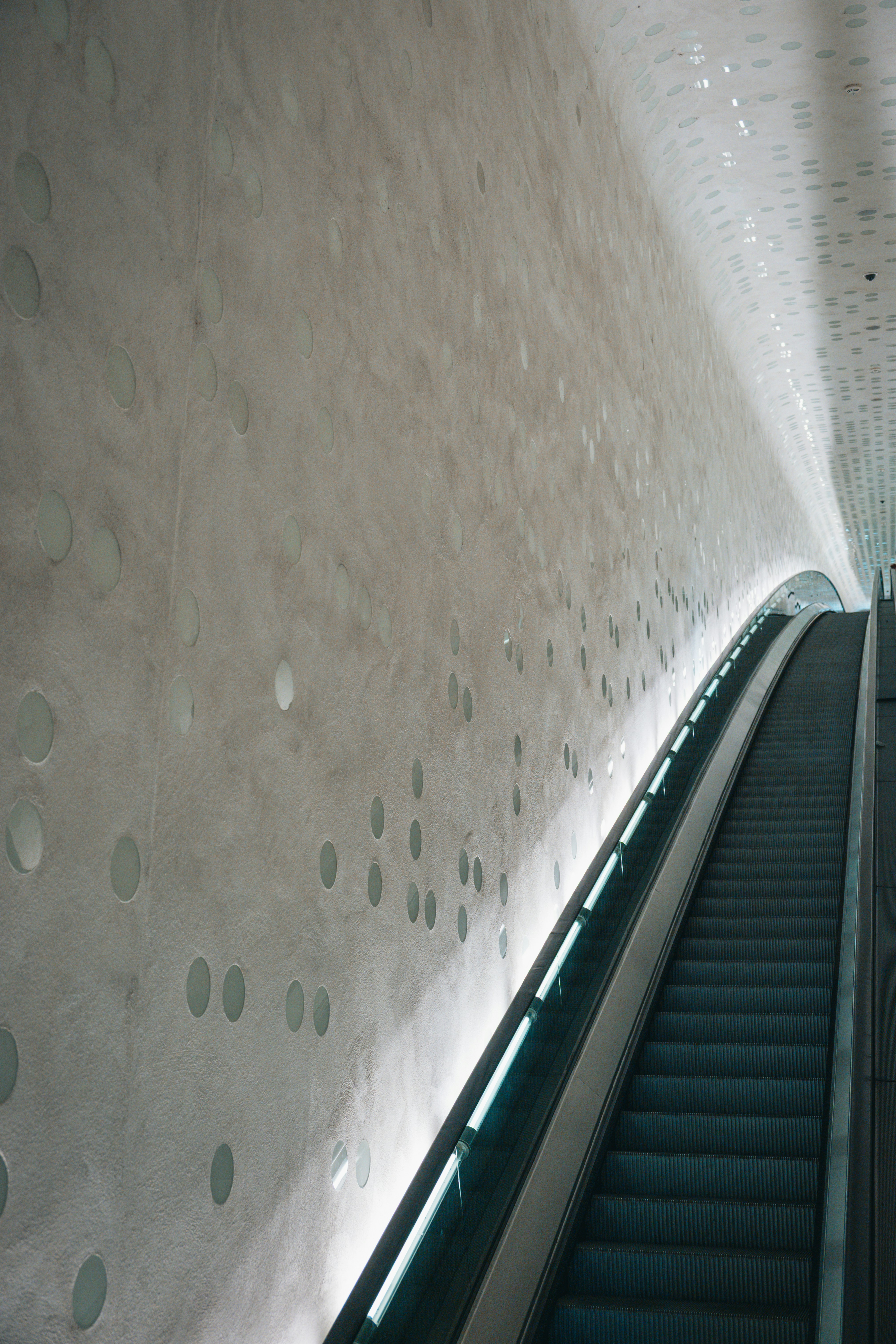 Modern escalator in a brightly lit building