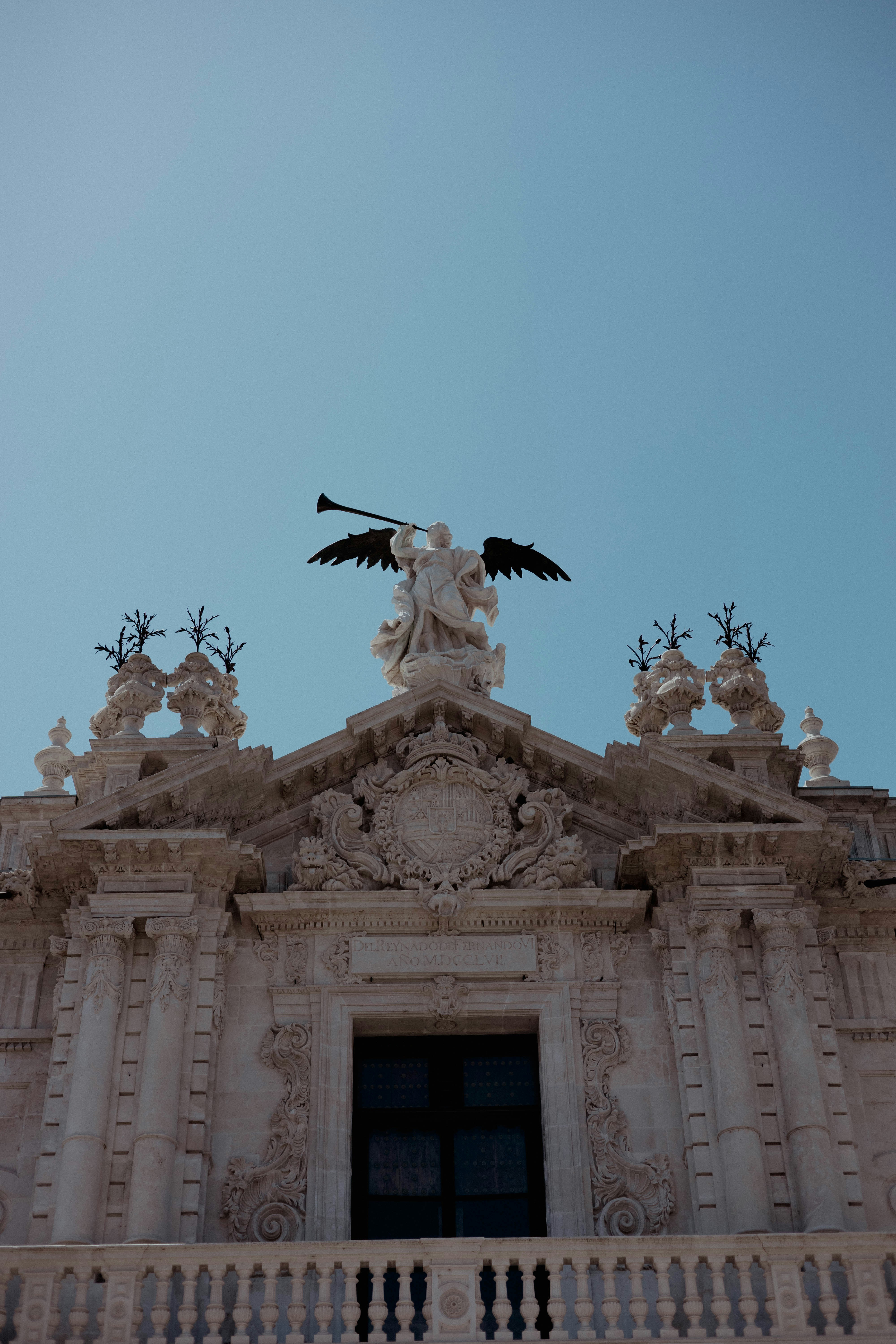 Winged Sentinel Over a Carved Baroque Summit