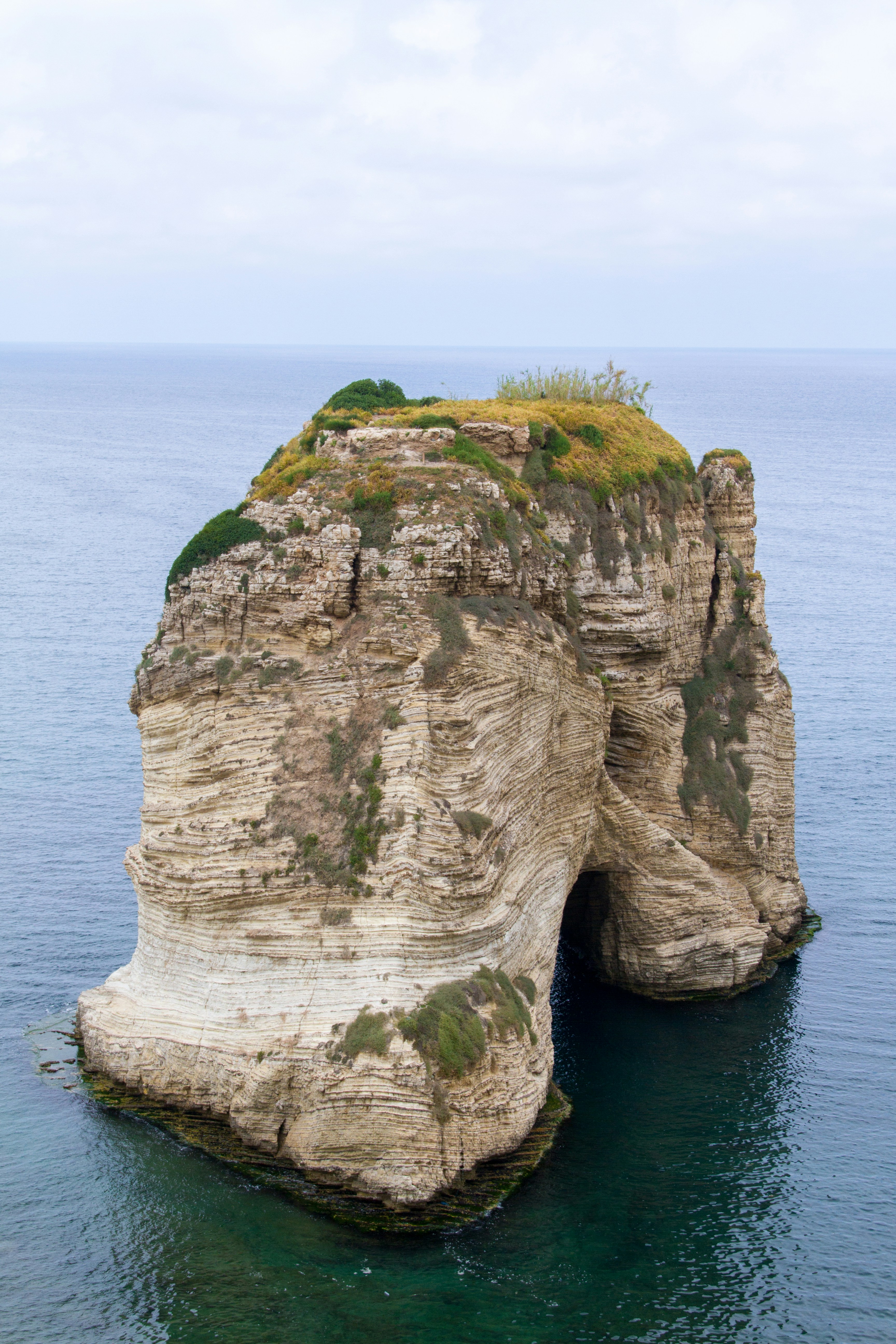 Landscape for rawsha rock in Beirut - lebanon | Rock formation with an arch in the sea