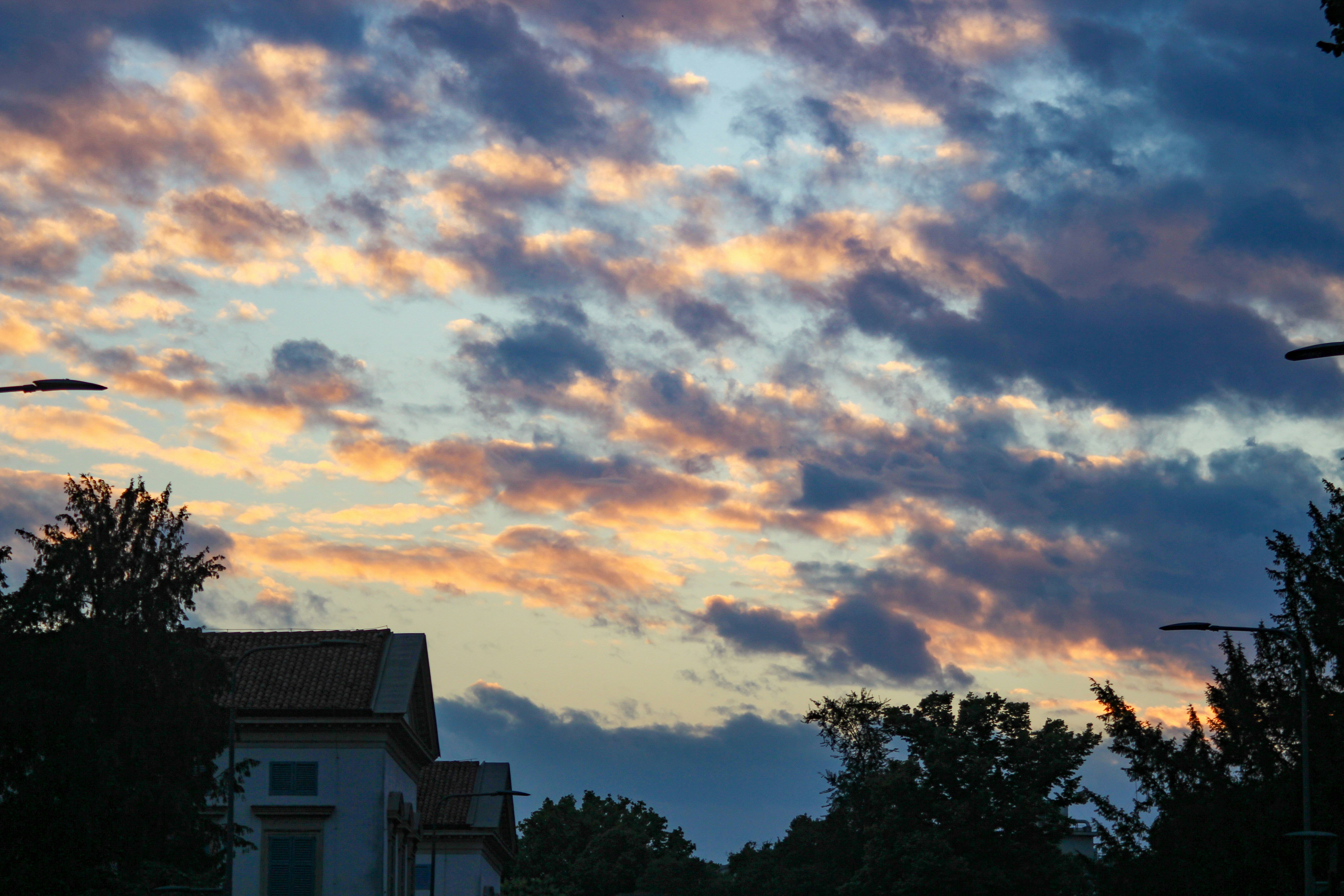 Milan- summer 2025 | Dramatic clouds at sunset over a quiet town