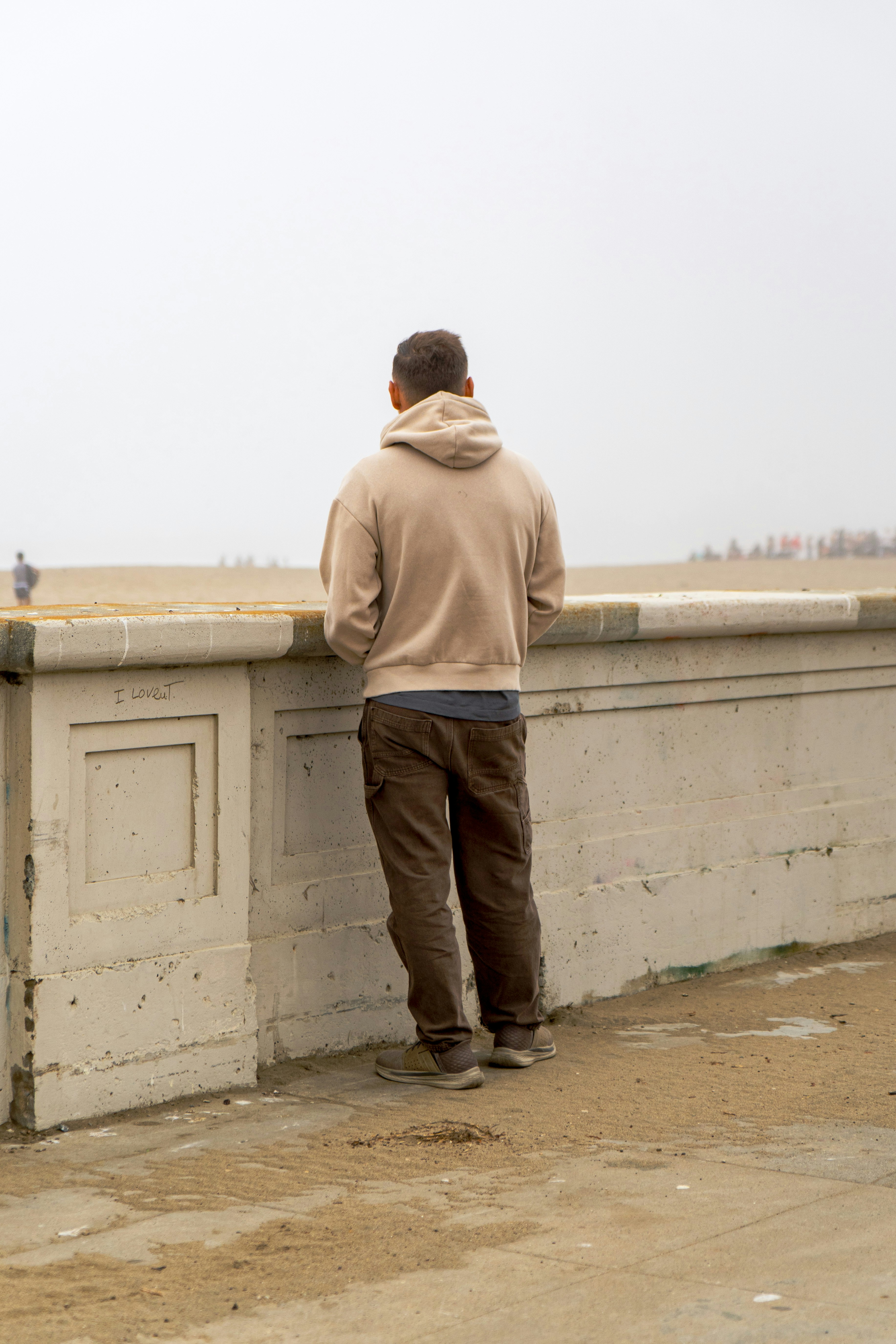 Quiet Contemplation at the Seafront Wall