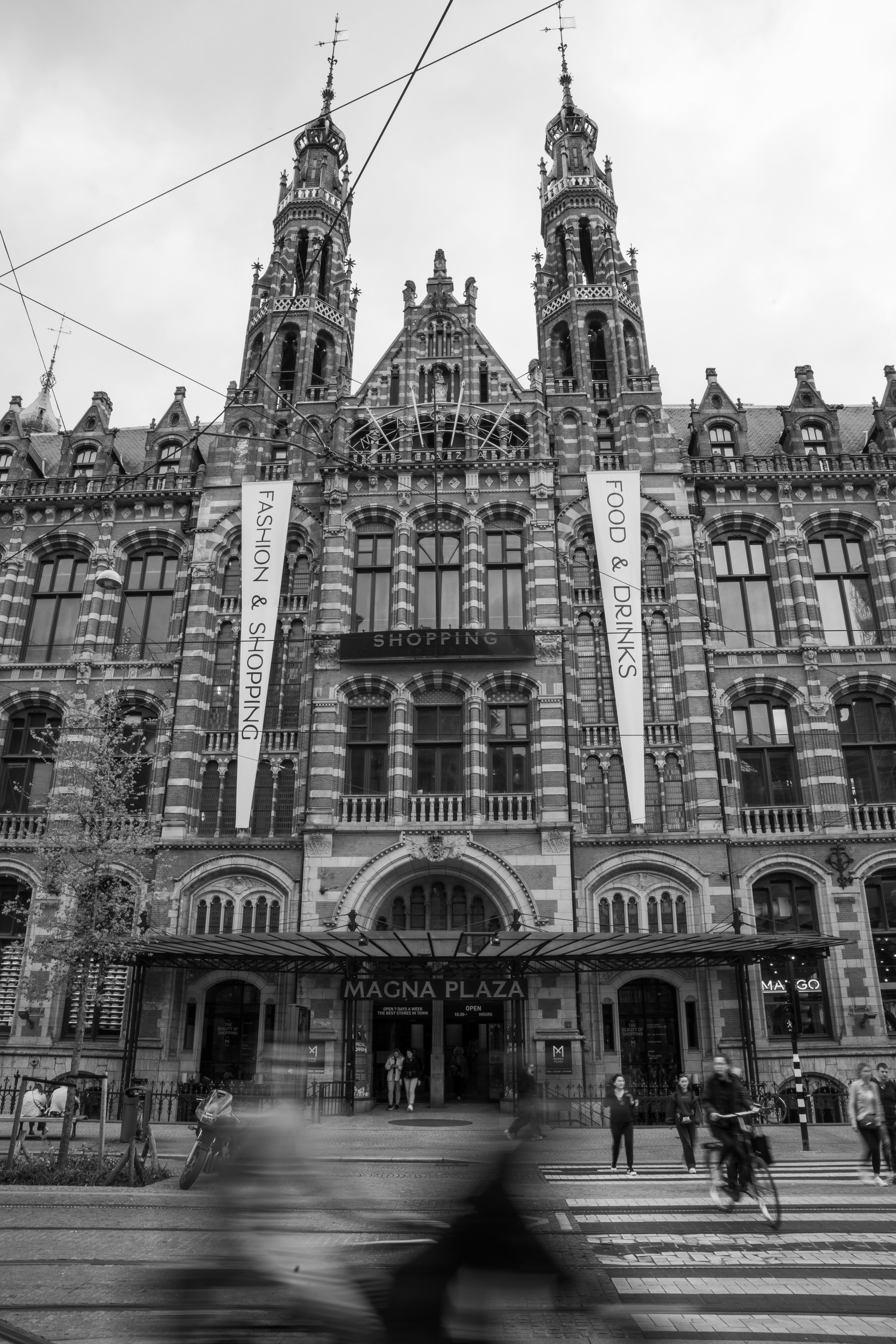 Neo-Gothic Grandeur on Magna Plaza's Bustling Façade