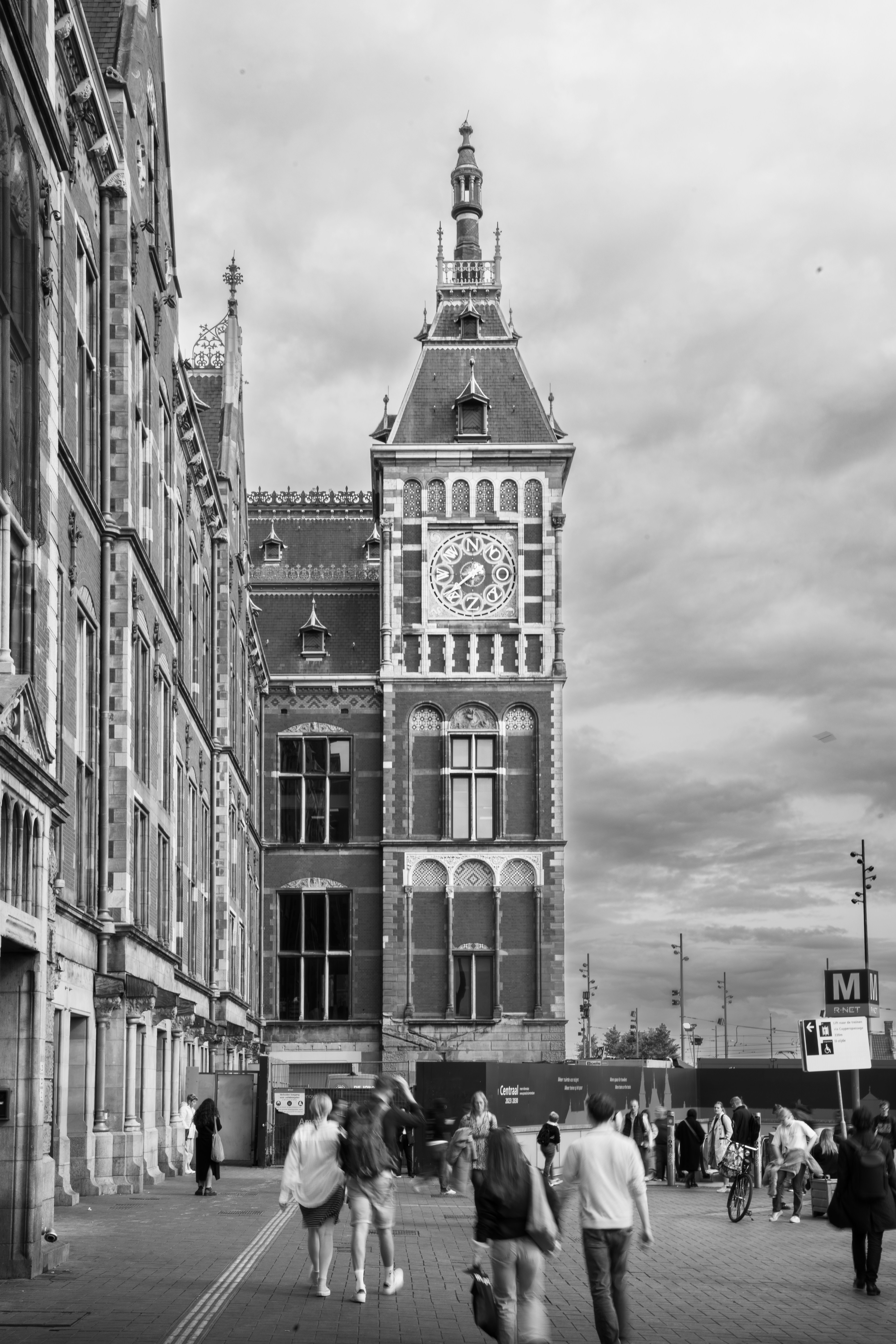 Historic building with a clock tower and people