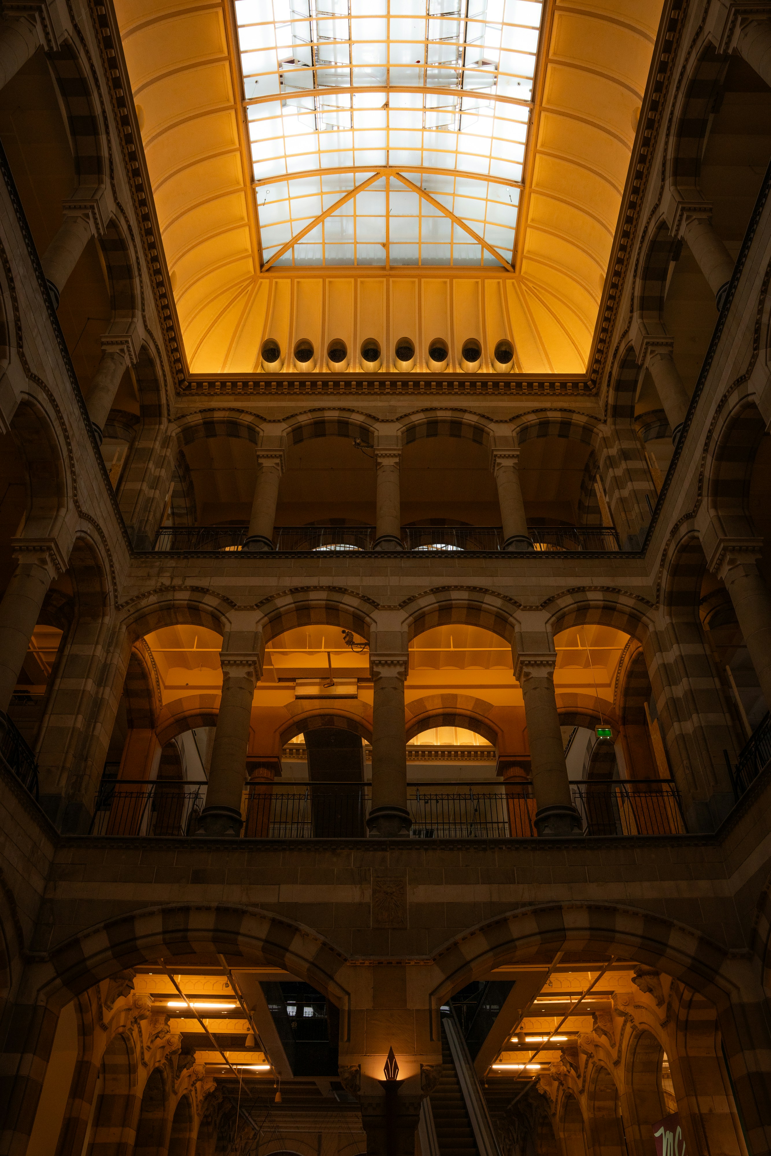 Interior view of a grand building with multiple levels.