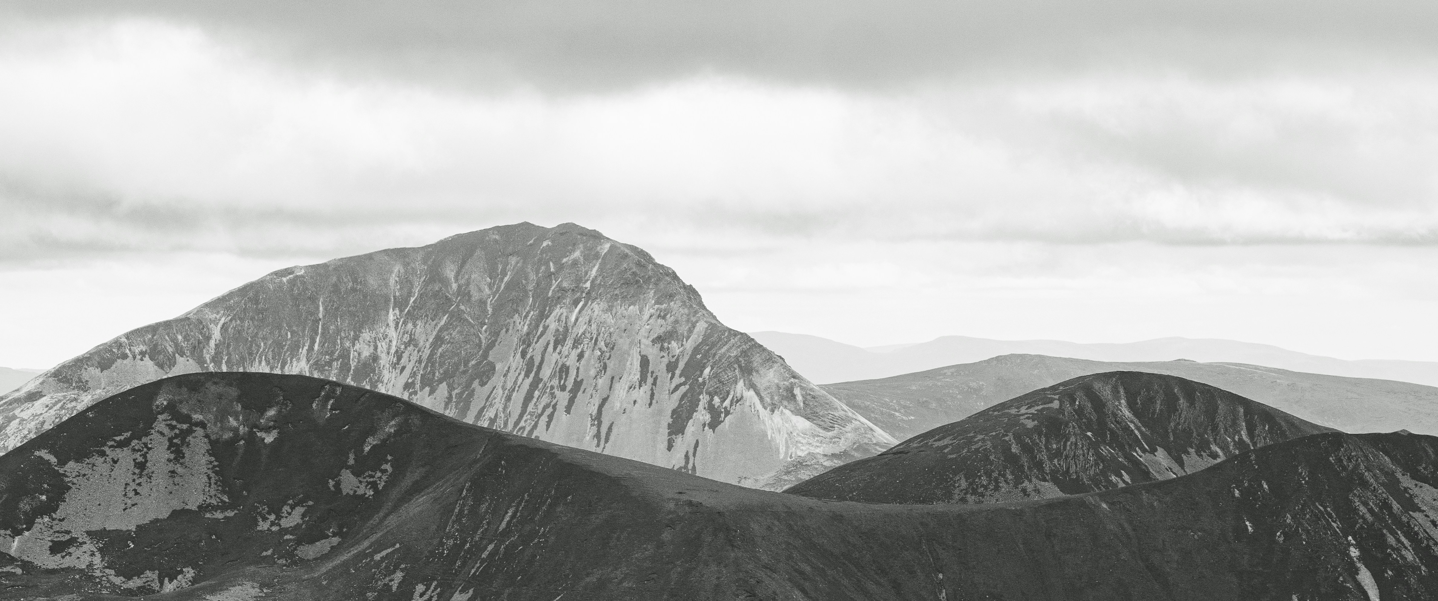 The view from Muckish Mountain looking towards Errigal | Dramatic mountain peaks under cloudy sky