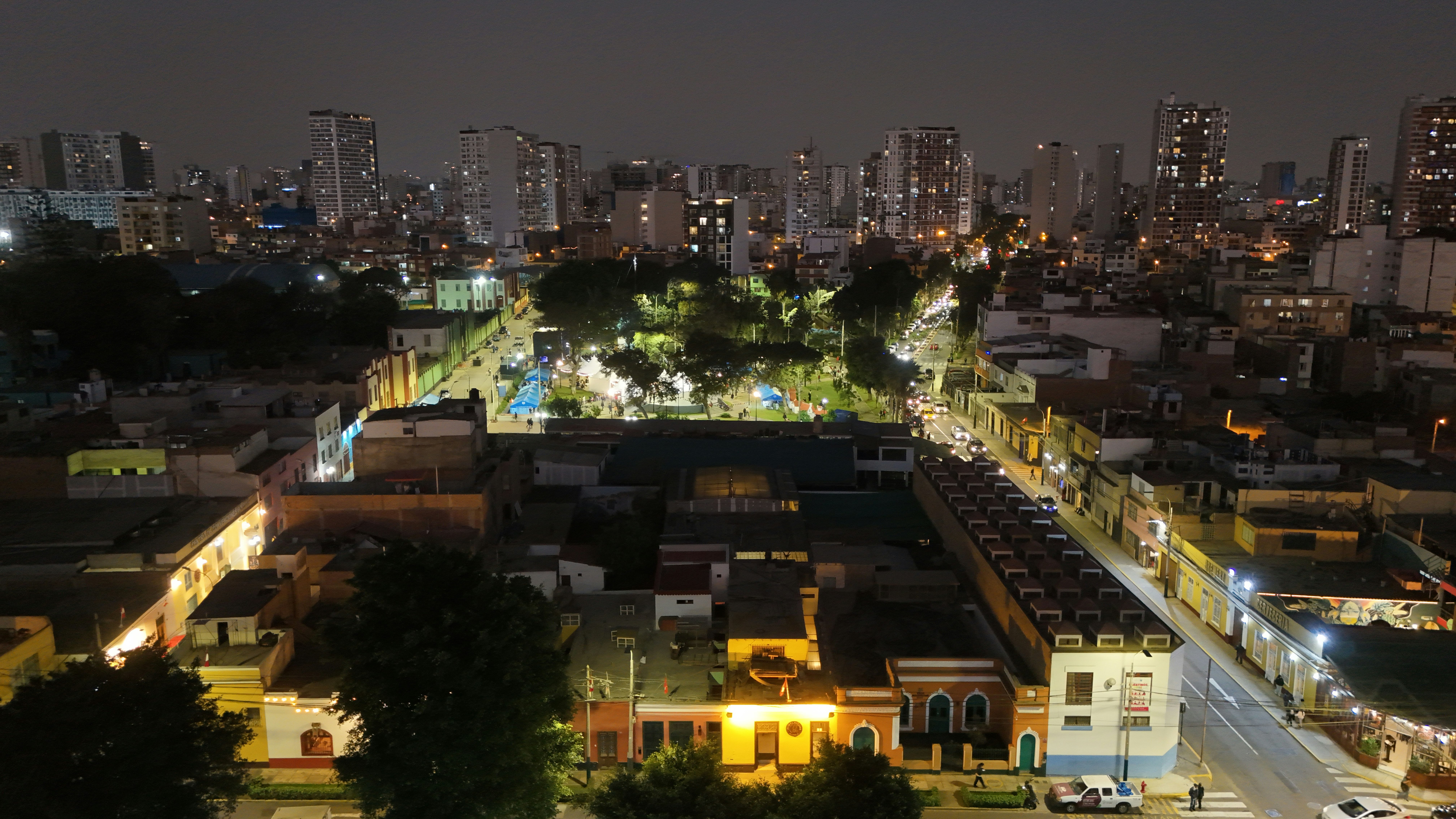 Pueblo Libre, Lima Peru. | Luminous cityscape with illuminated park at night