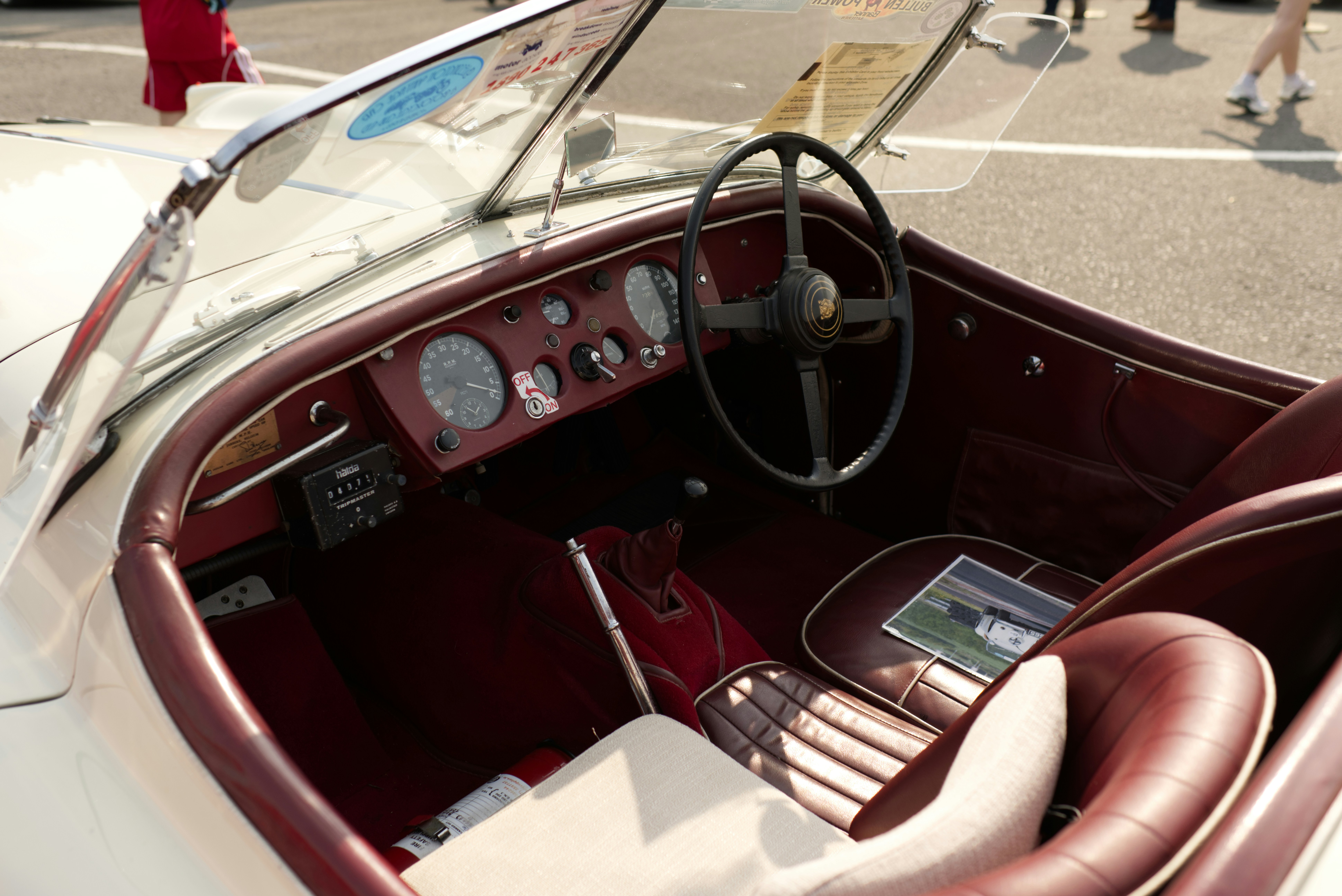 Velvet Cockpit: Burgundy Leather and Analog Gauges in a Timeless Convertible