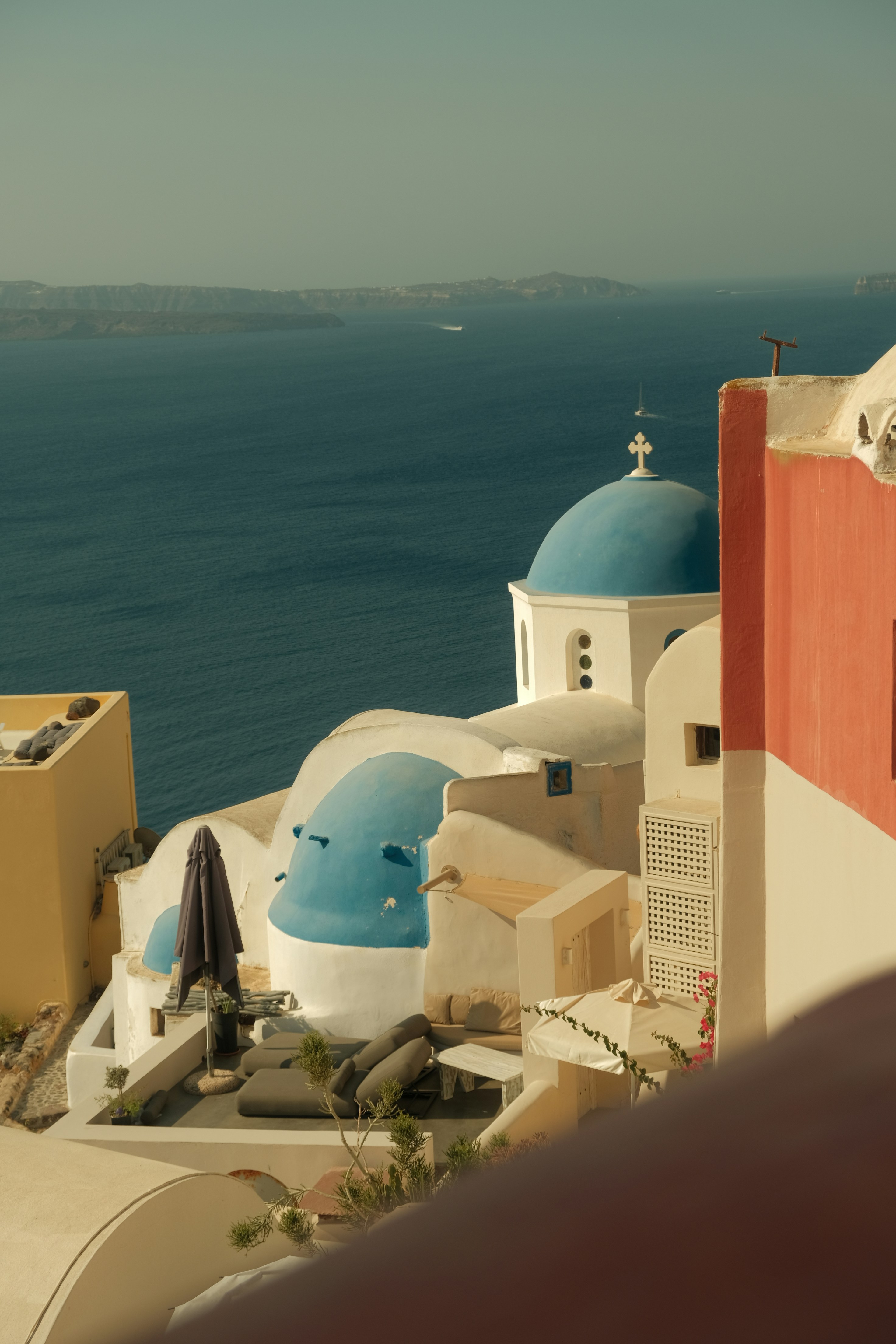 Azure Domes Above Santorini’s White-Washed Terraces Over the Aegean