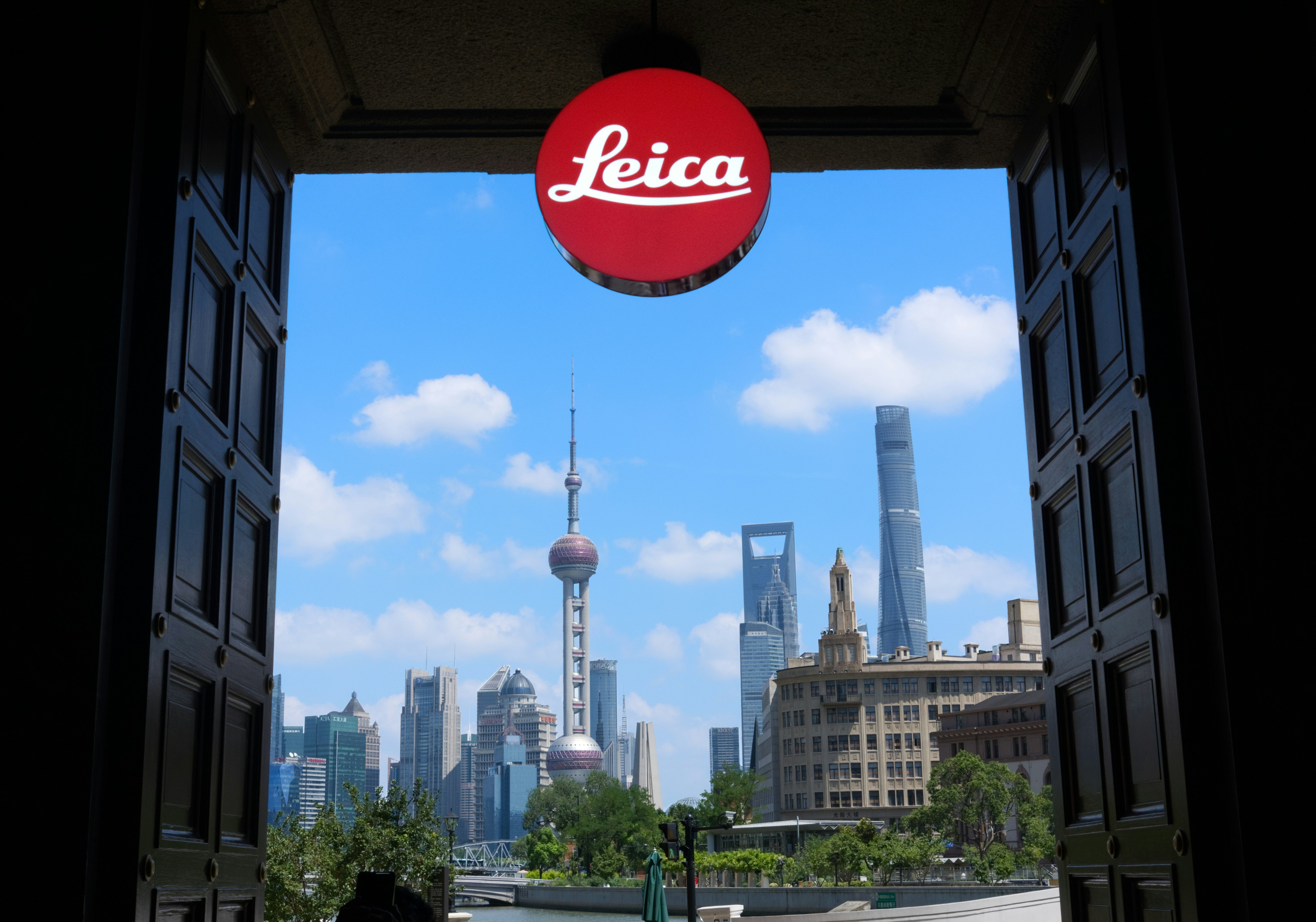 Leica sign above shanghai skyline on a clear day