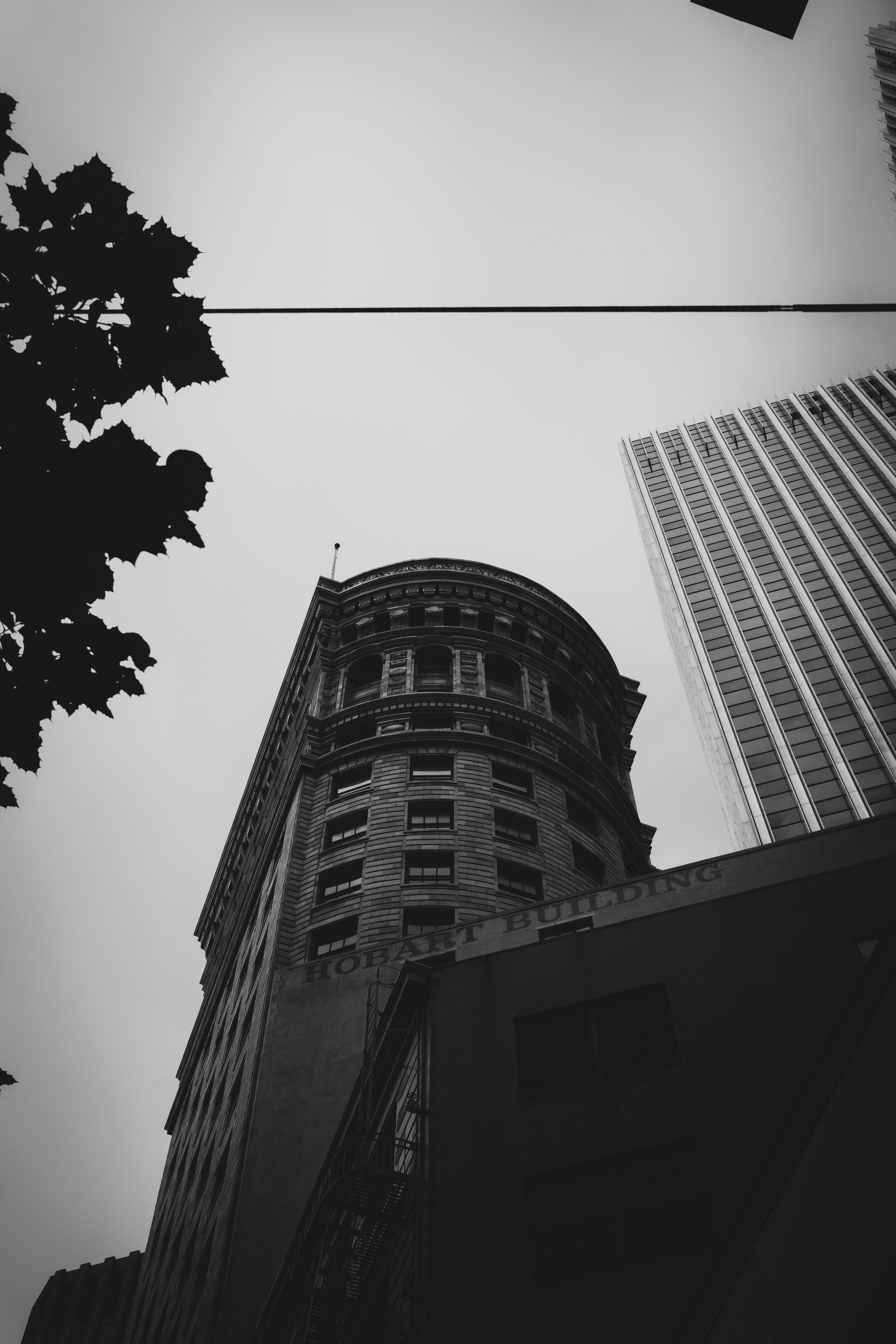 Looking up at historic and modern buildings