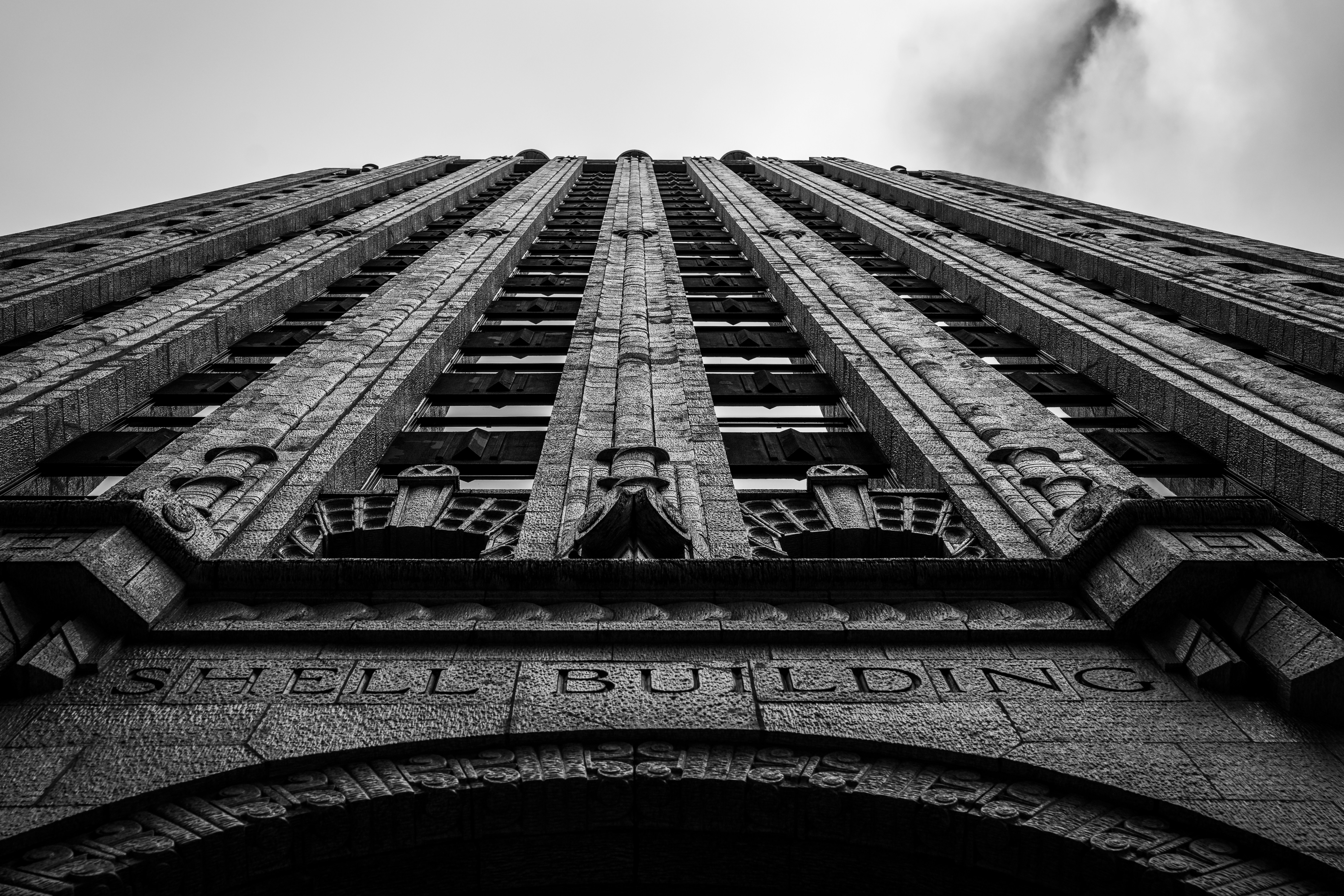 Stone Facade Ascendant: A Low-Angle Portrait of a Monument
