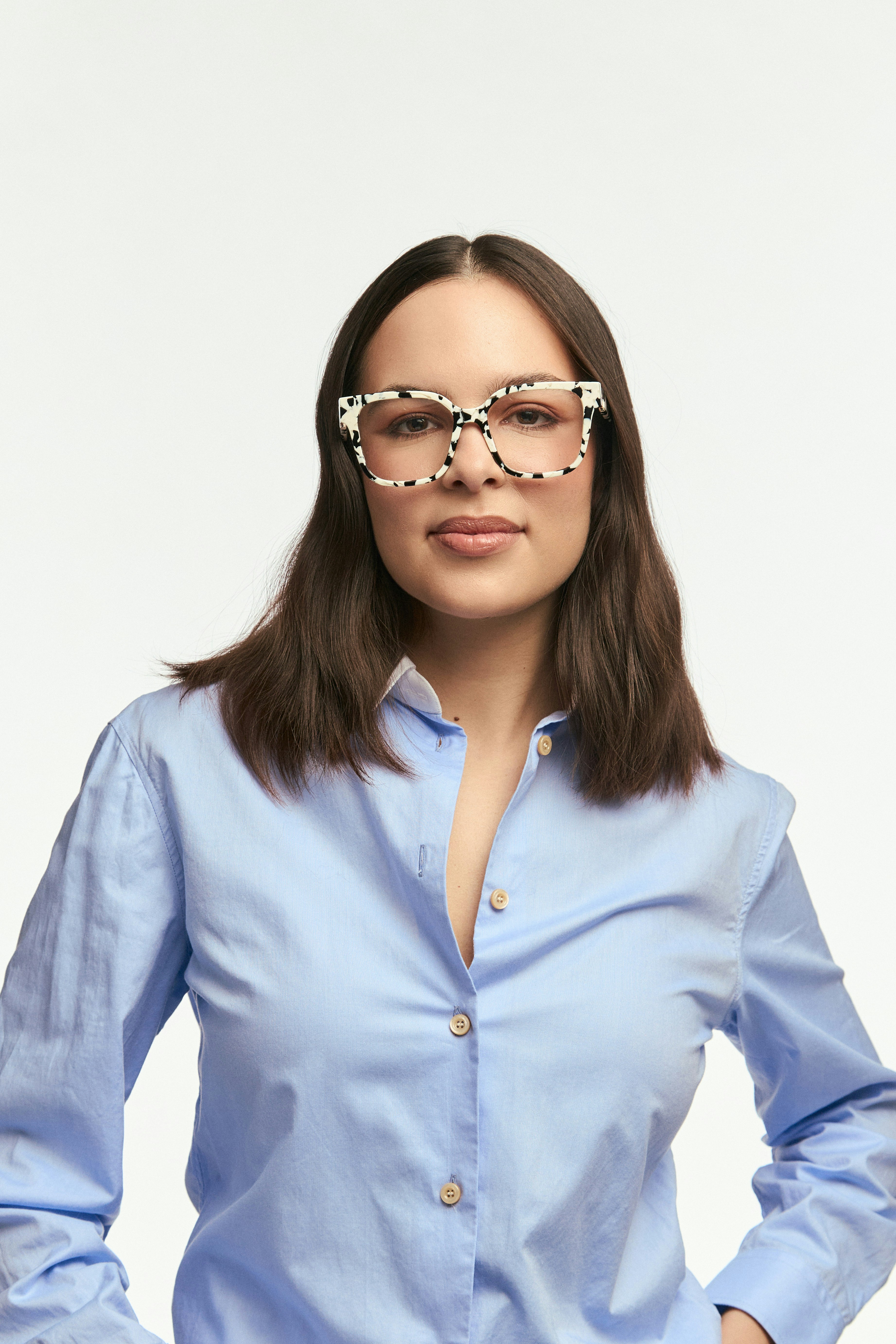 Portrait in Studio Light: Bold Glasses and Blue Button-Down