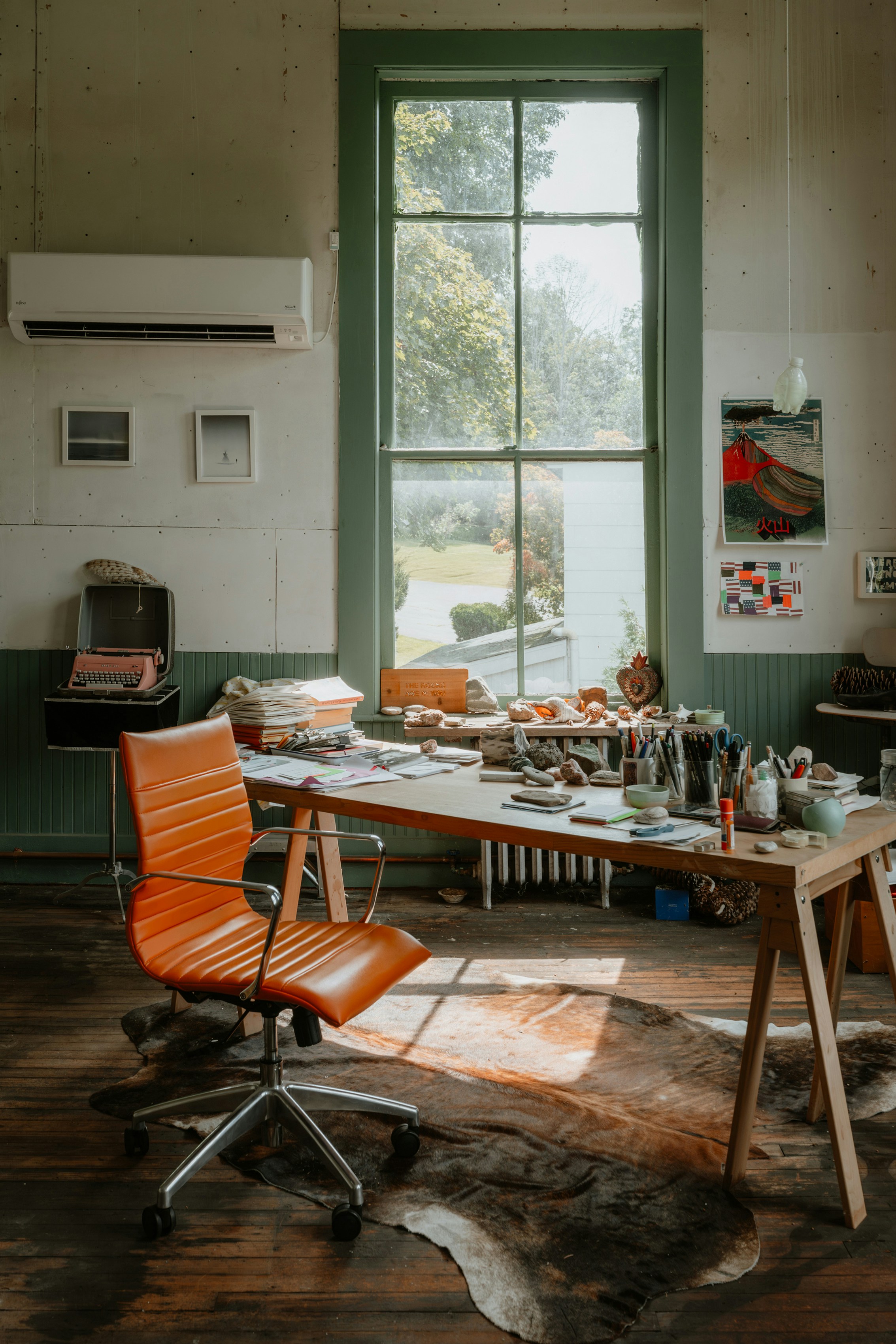 Artist's studio with desk, chair, and large window photo – Free Desk ...