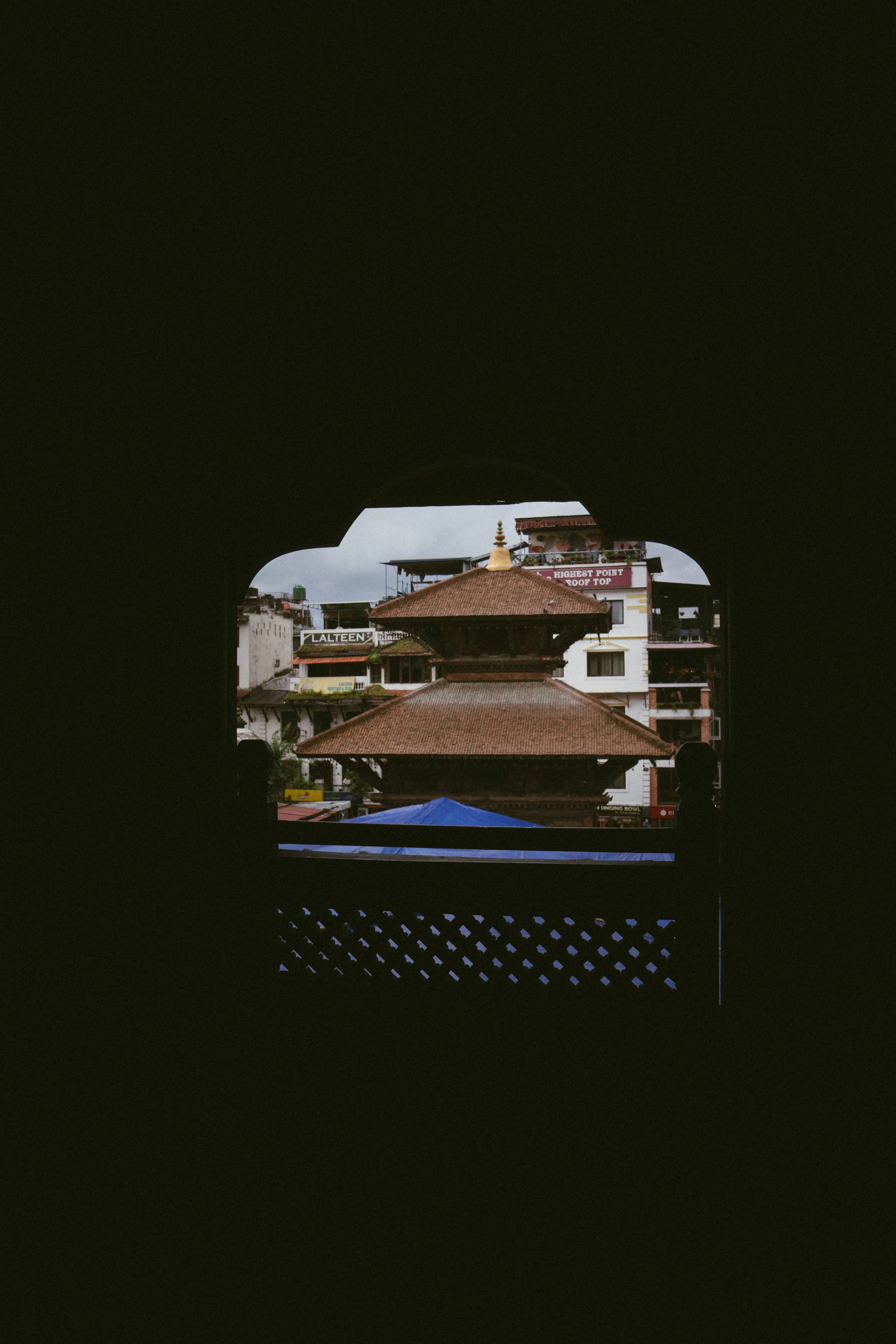 Traditional pagoda temple seen through arched window