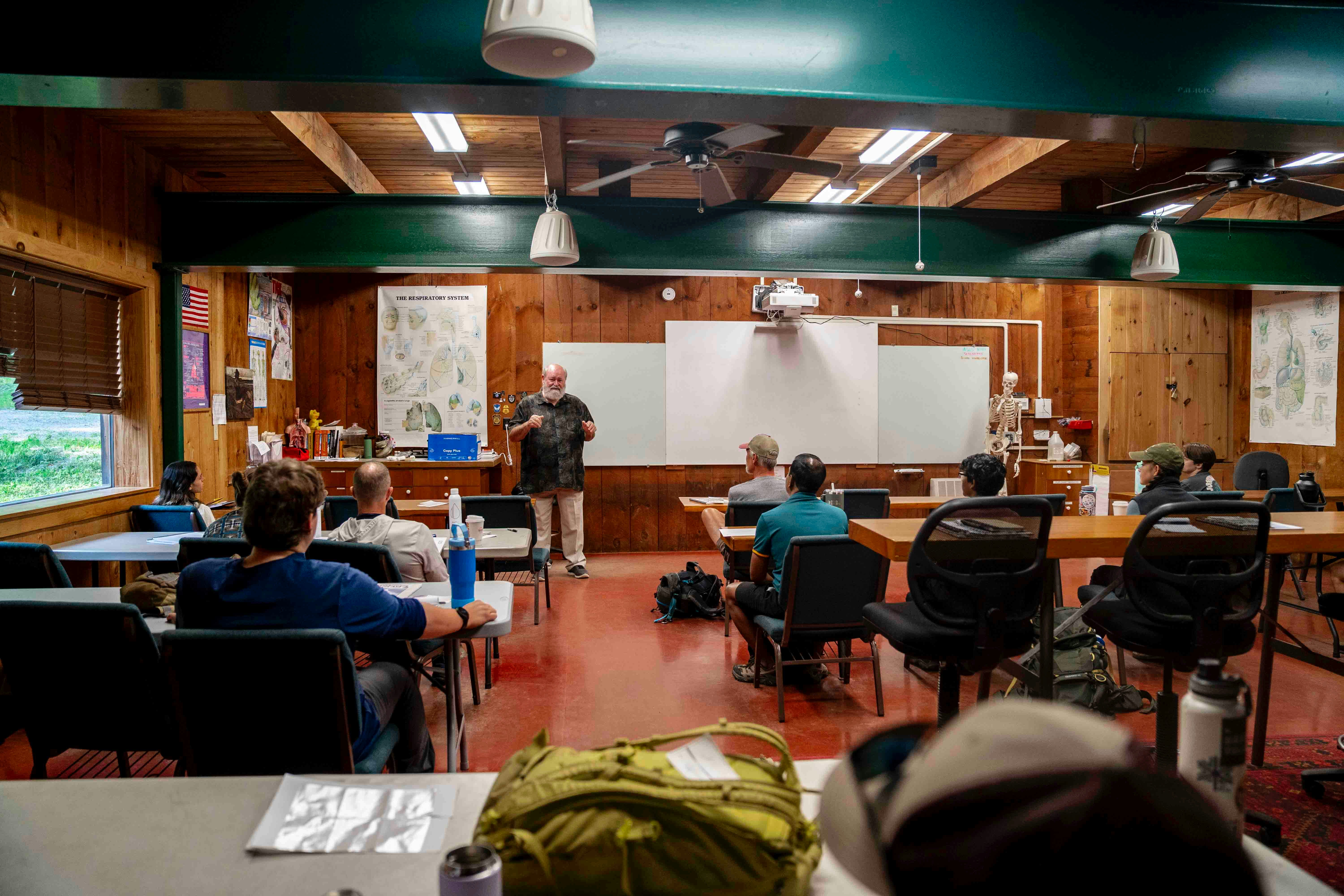 Teacher instructing students in a classroom setting photo – Free Man ...