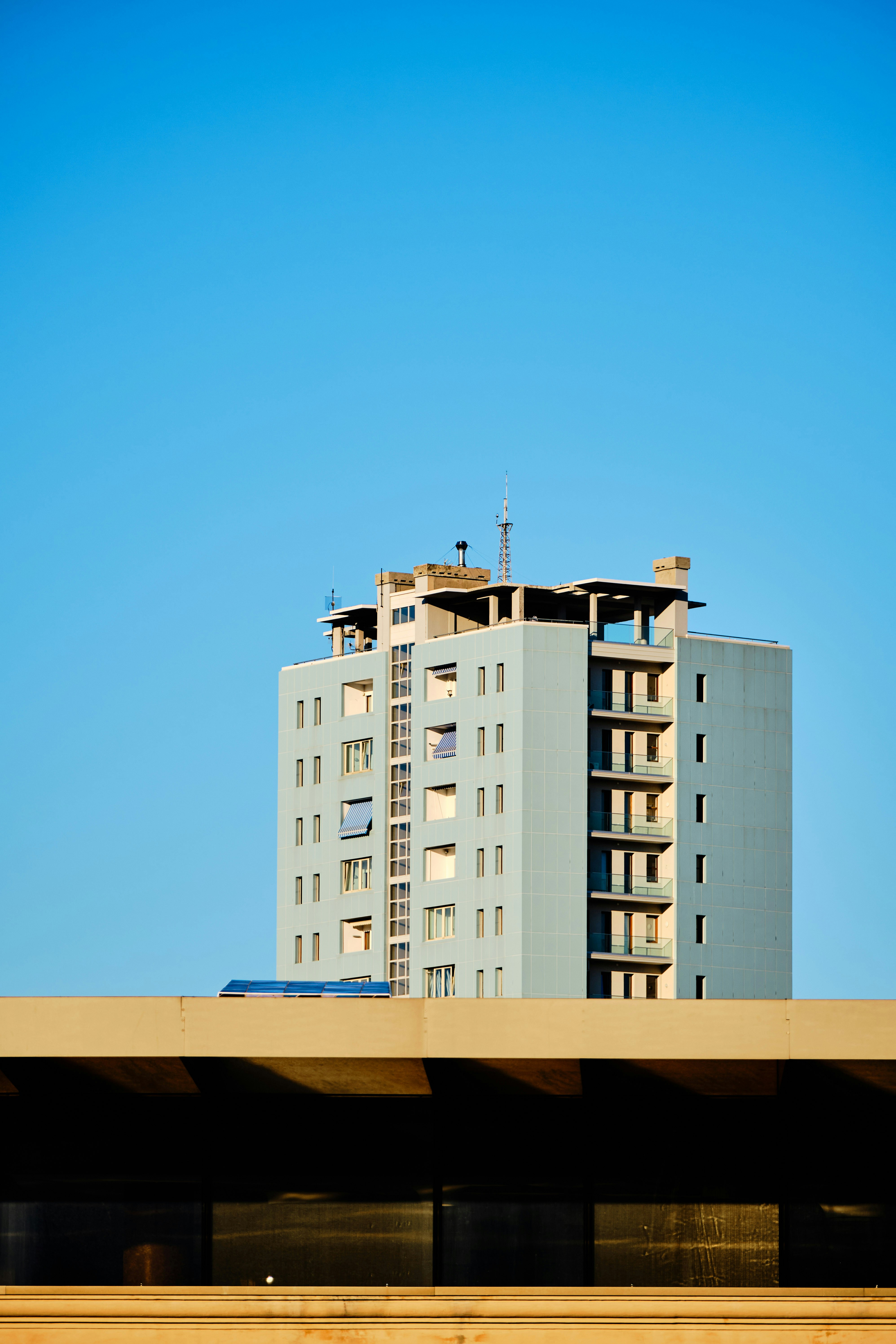 Trieste, Italy | Modern building against a clear blue sky