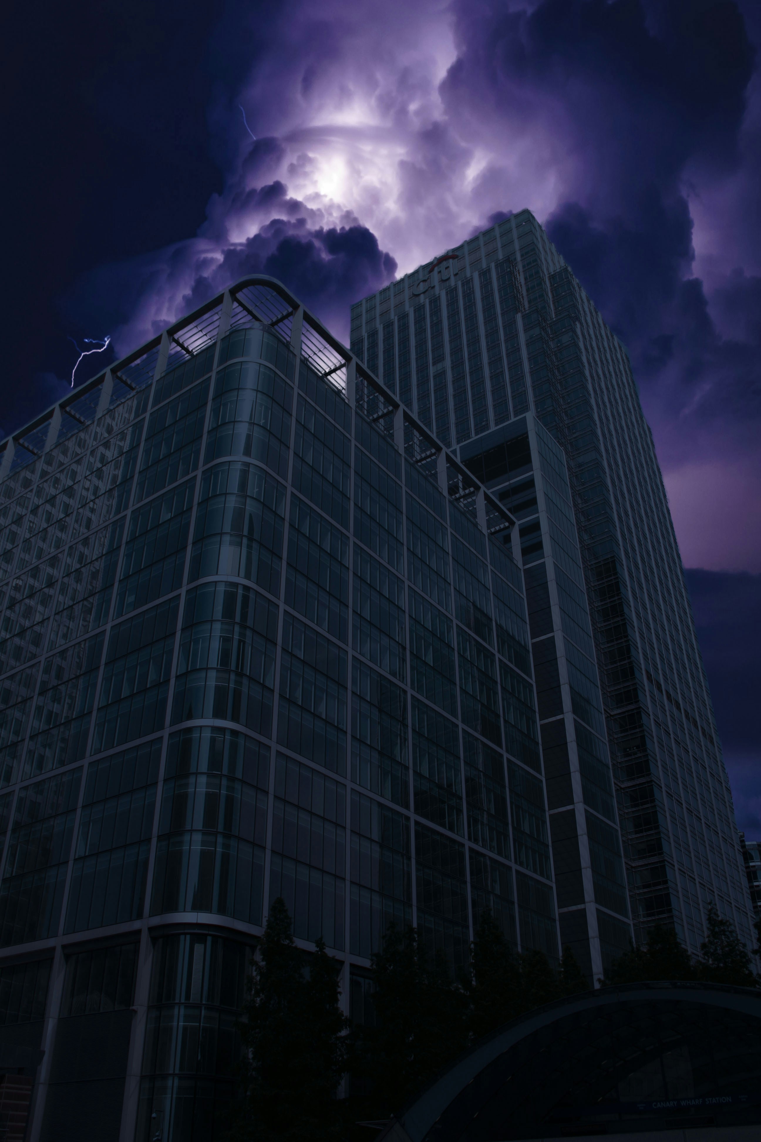 Electric Skyscraper Under Stormy Skies