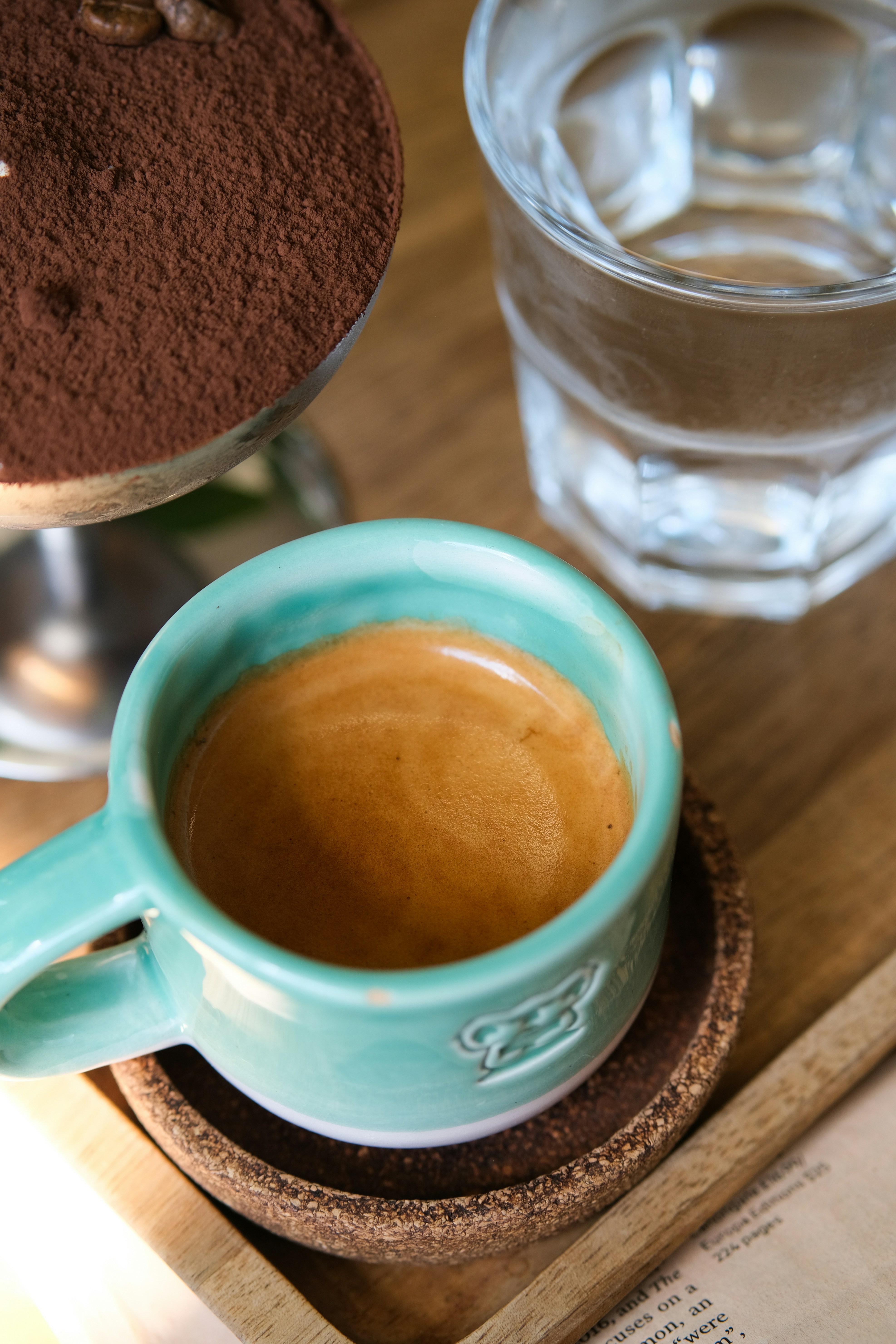A cup of espresso with a glass of water. photo – Free Food Image on ...
