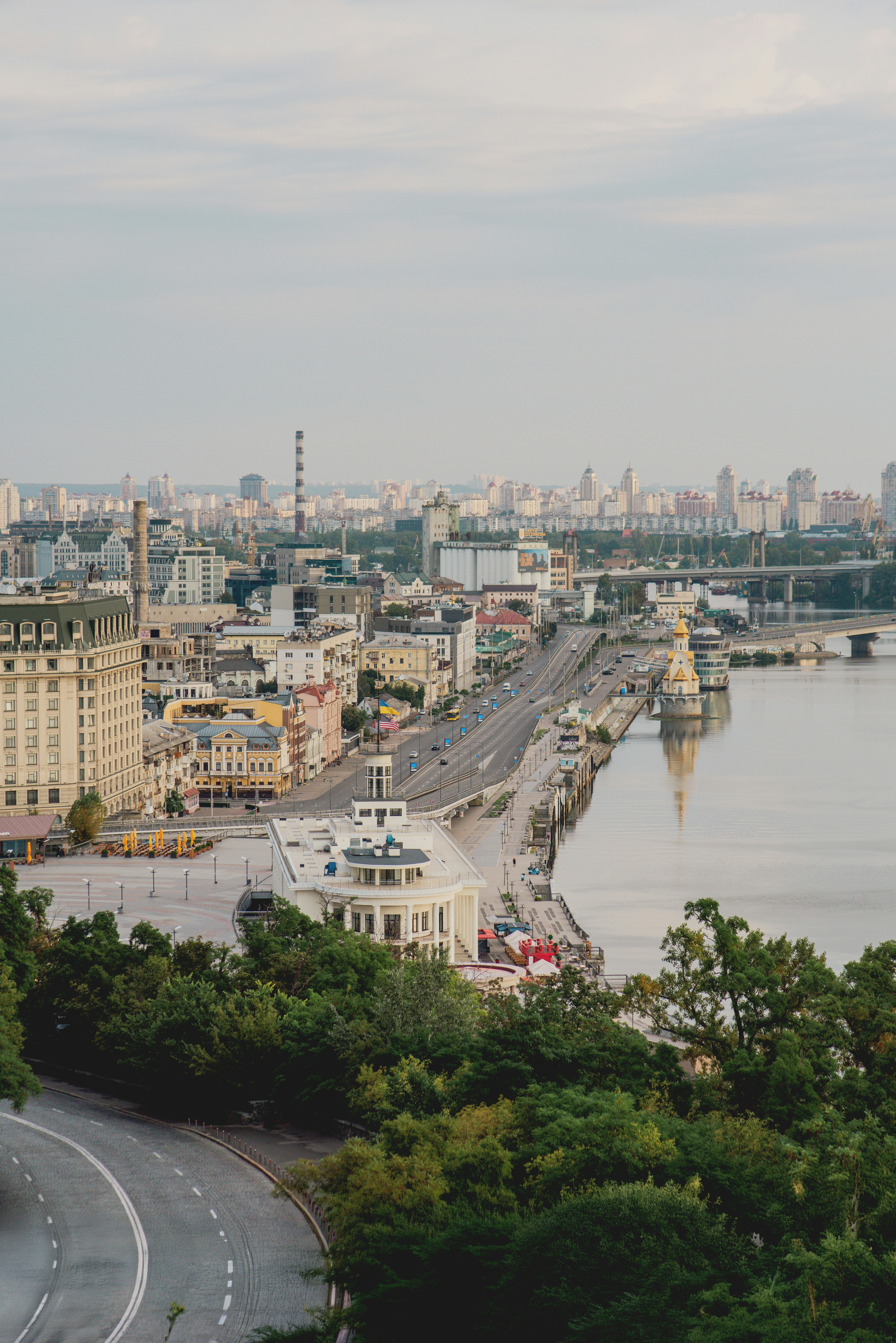 Aerial view of a city with a bridge over a river.