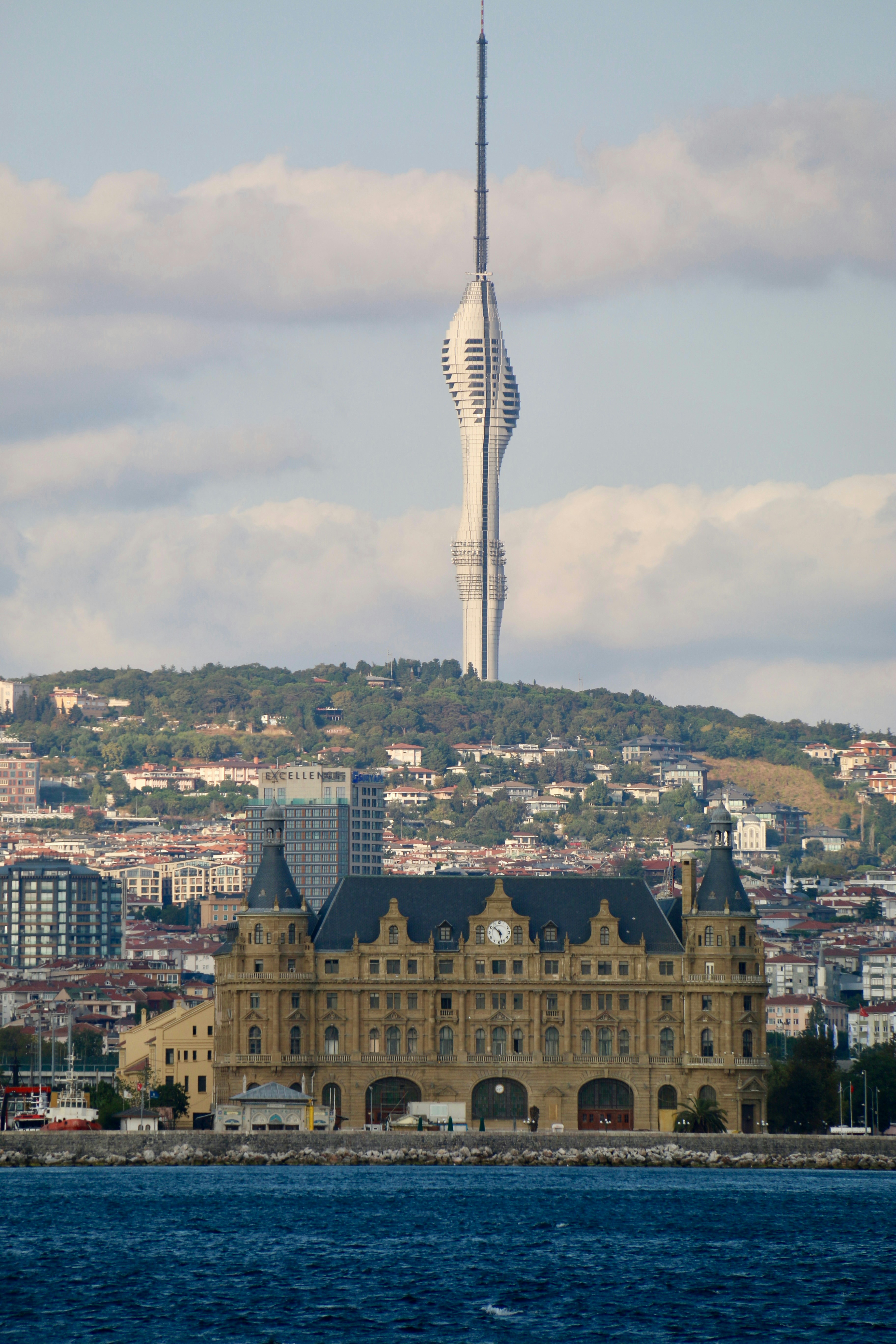 Historic train station with modern tower in background