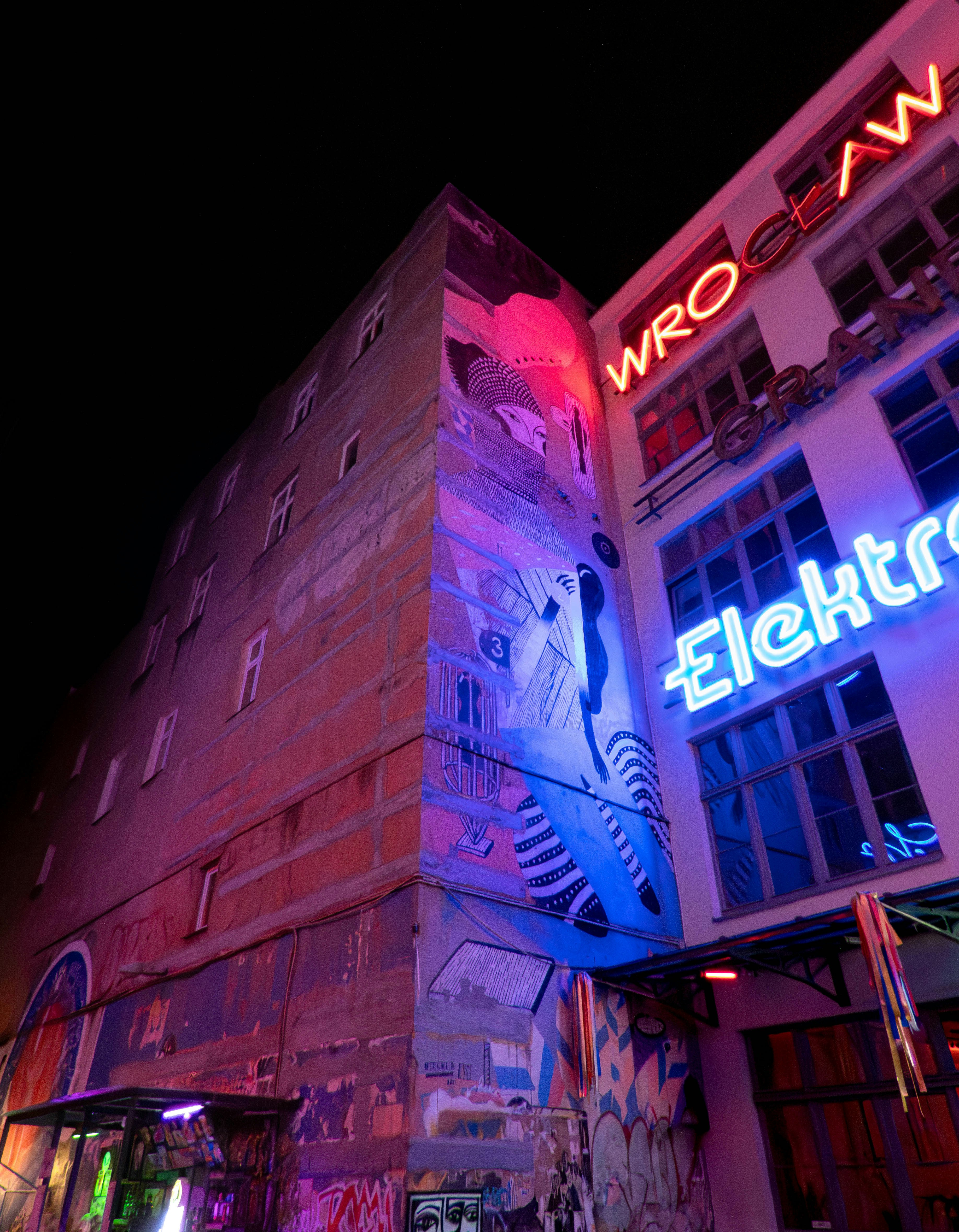 Neon Mural at the Night Corner: Pink and Blue Graffiti Glow