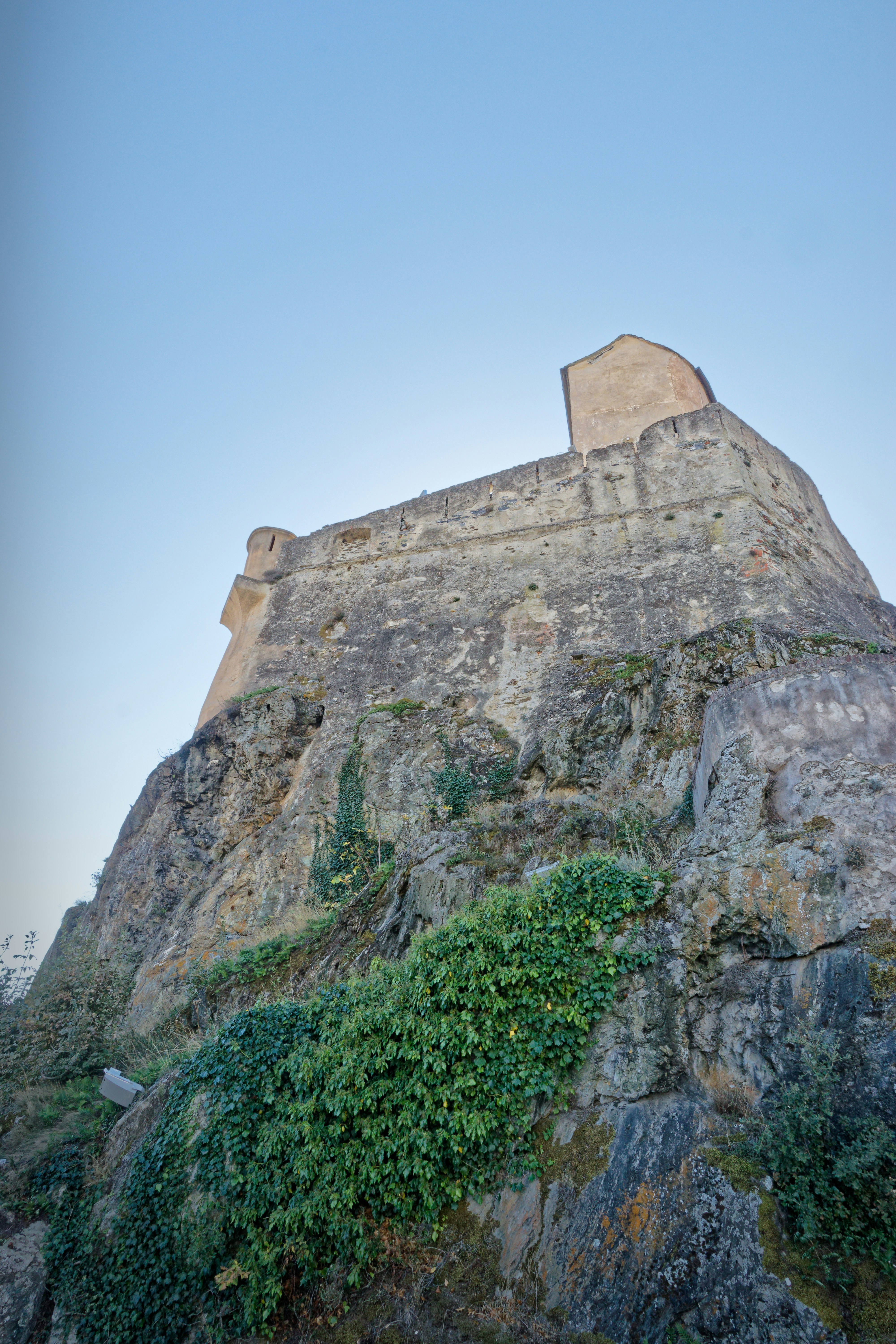 Ancient stone fortress perched on a rocky cliff