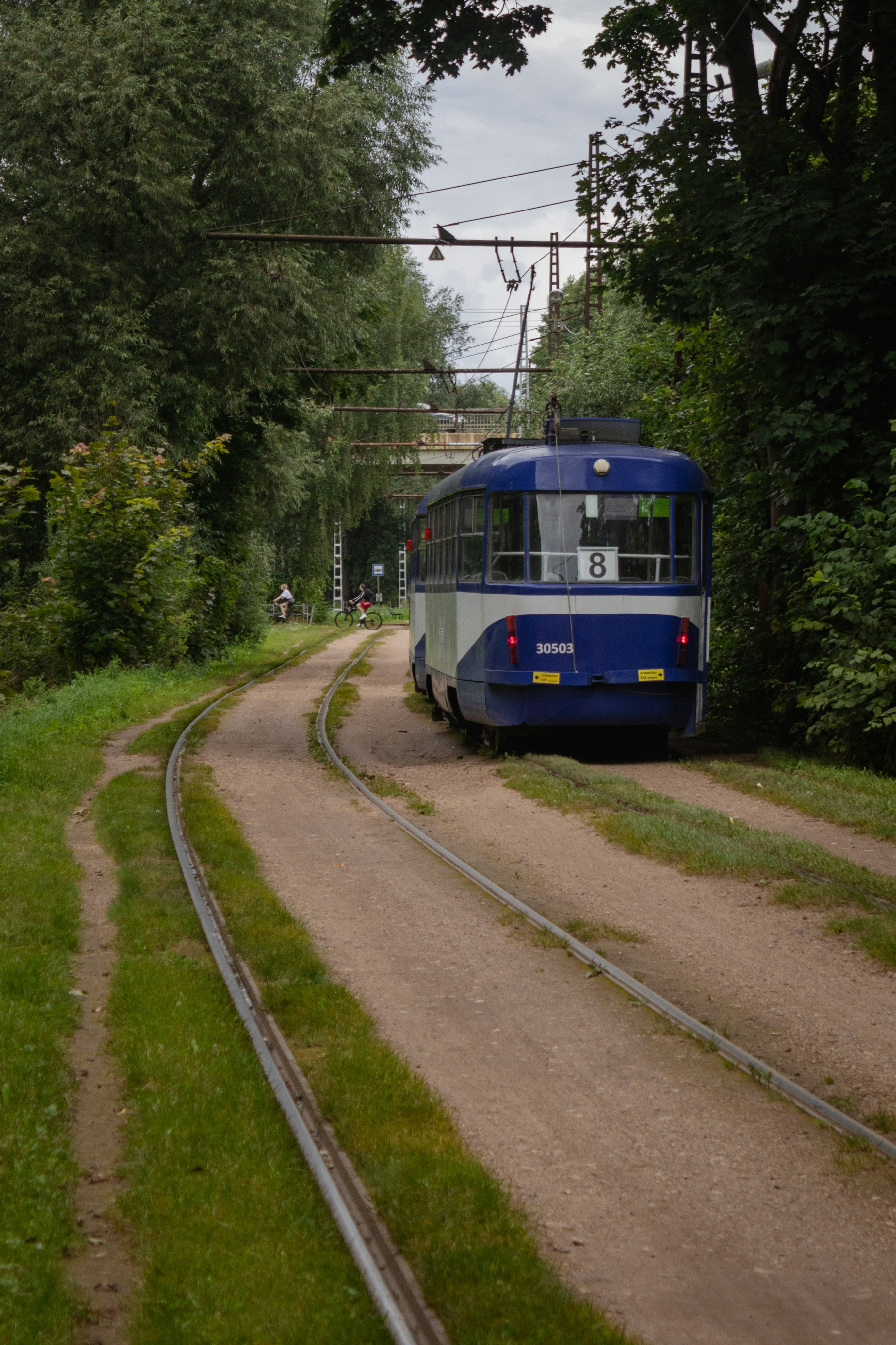 A blue and white tram on a rural track. photo – Free Transportation ...