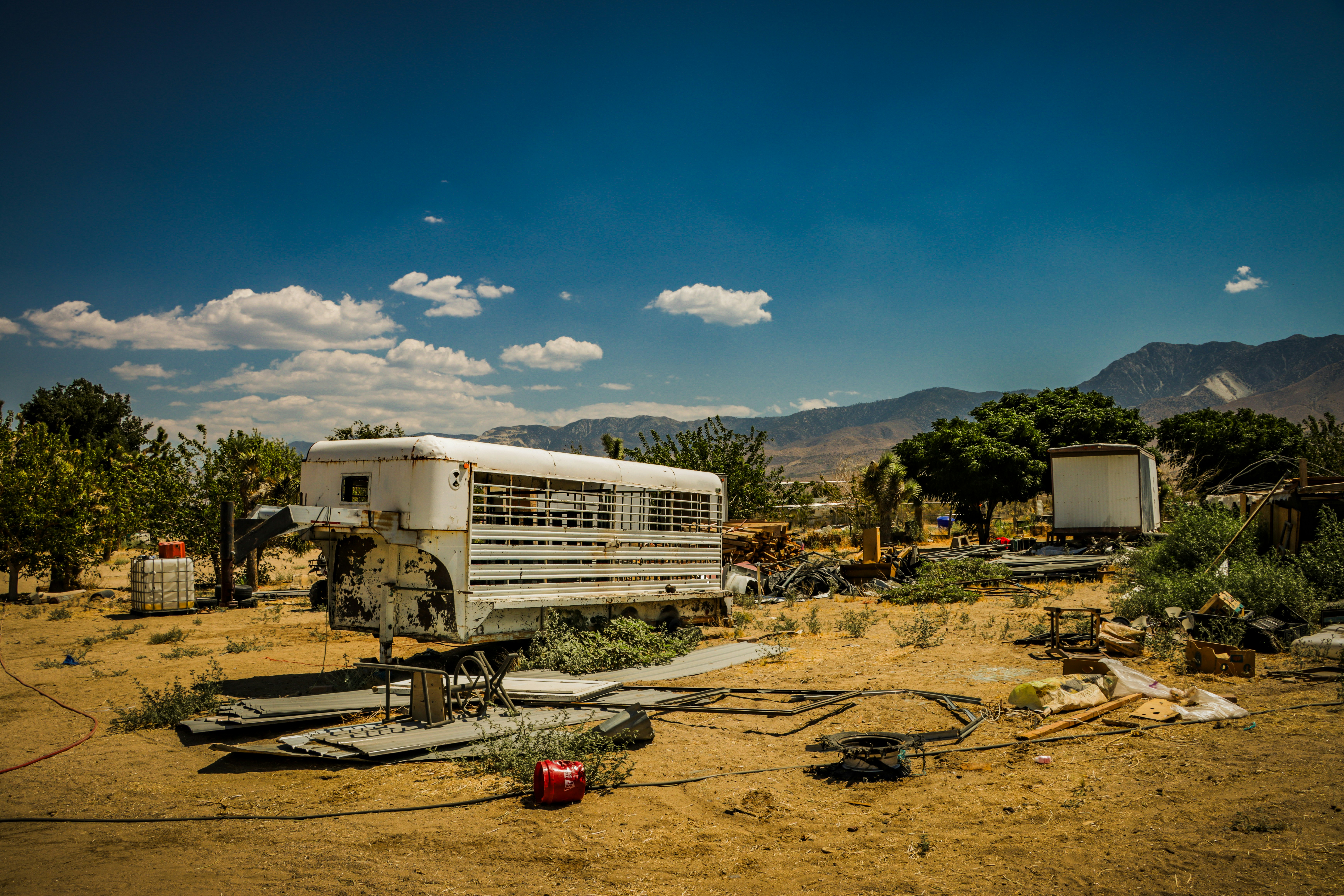 Abandoned trailer in a dry, rural landscape