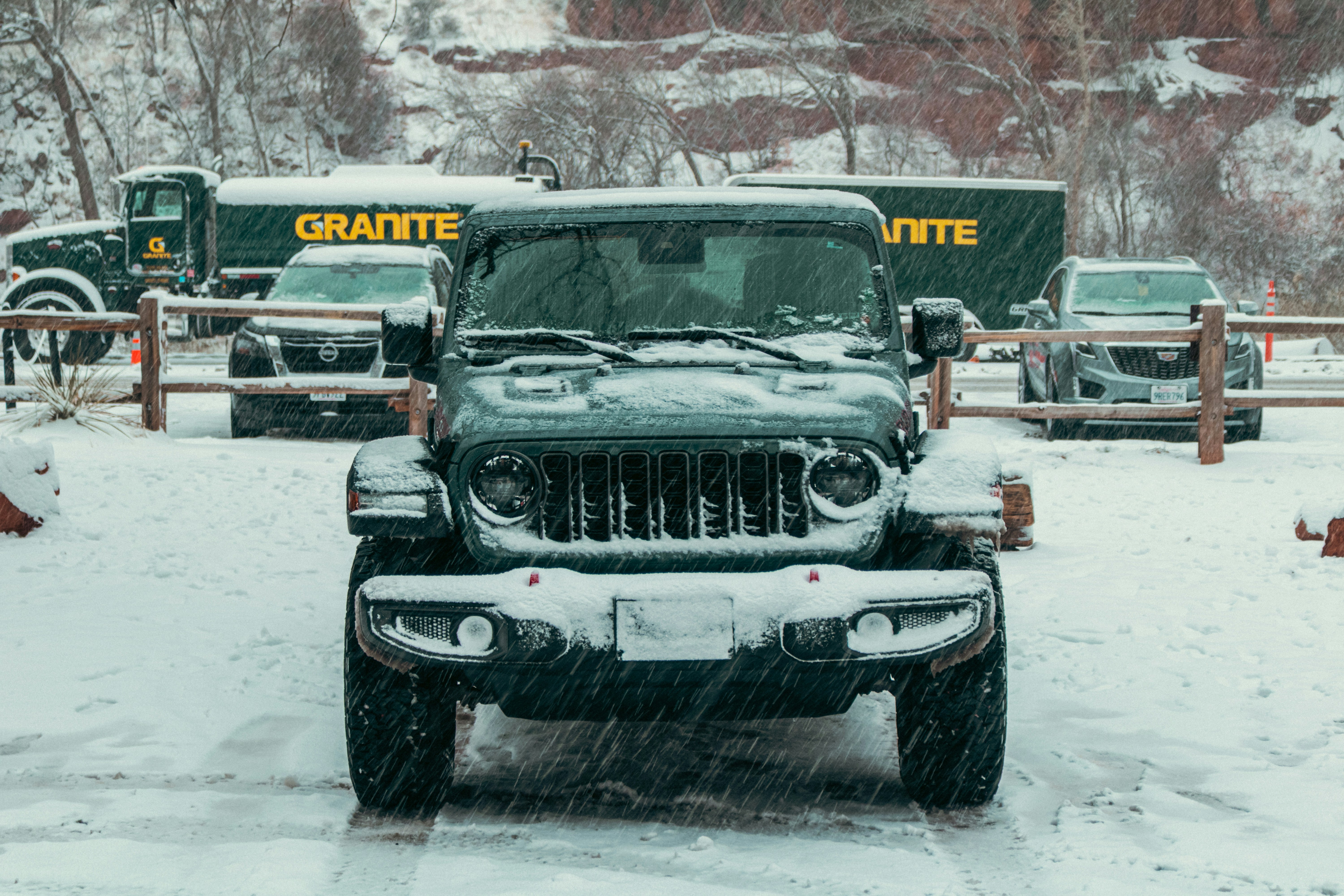 Winter's Embrace: The Rugged Jeep in a Snowy Landscape