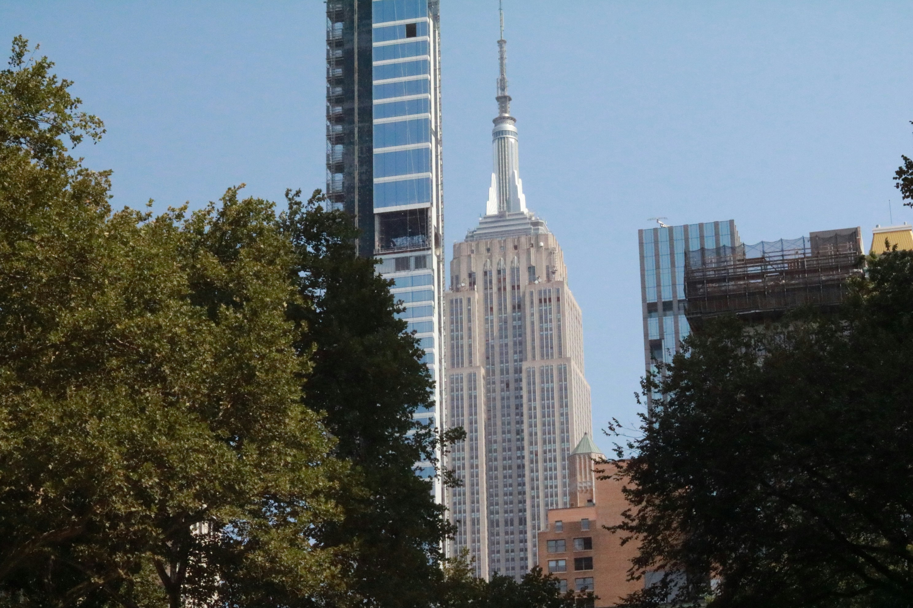 Empire state building with surrounding modern skyscrapers