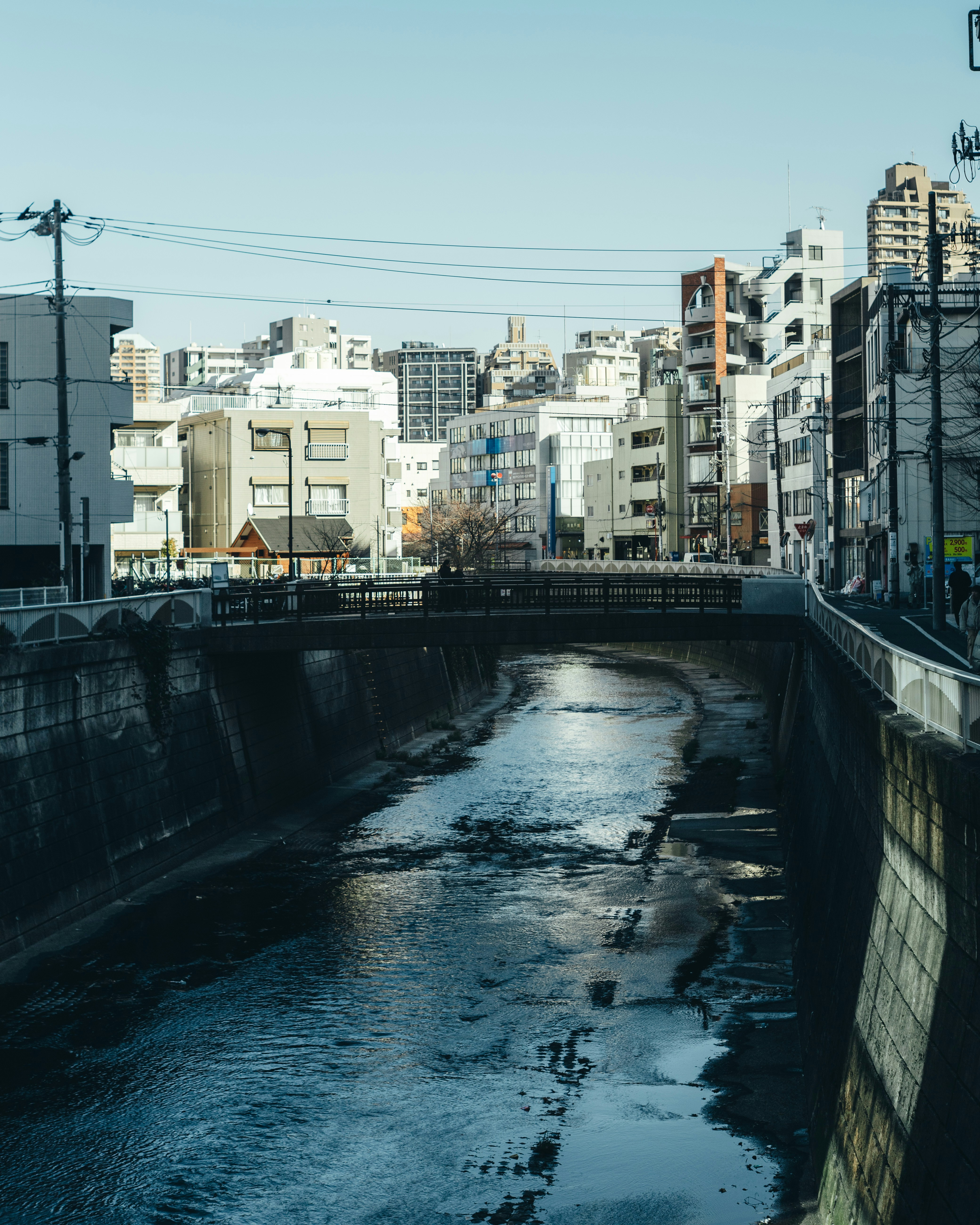Canal Crossing: A Quiet Pulse Through the Concrete Skyline