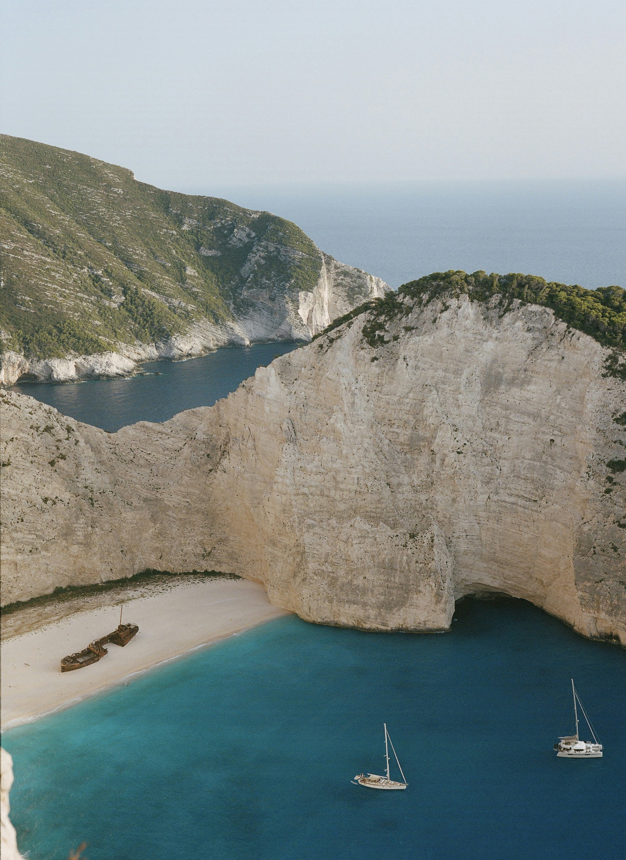 Shipwreck on a sandy beach with turquoise water