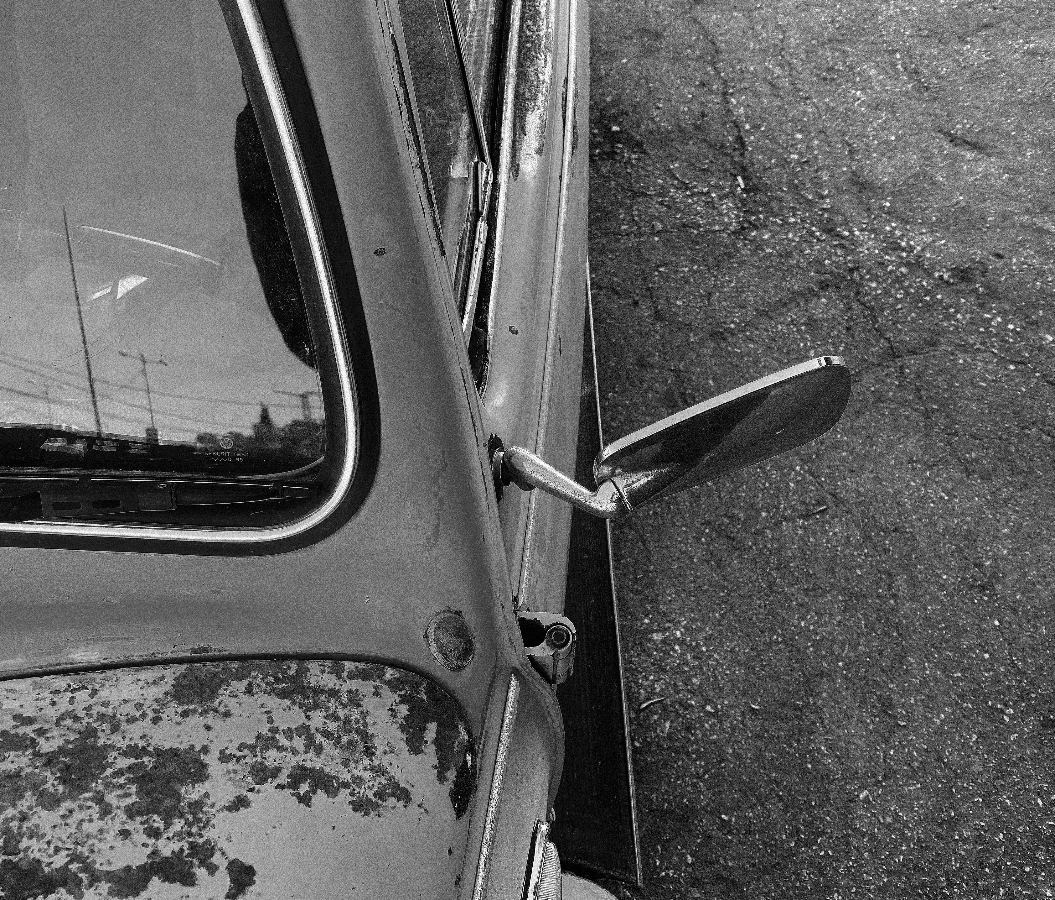 the non-stop using of Volkswagen Beetle in Palestine. حبوشيت | Side view mirror on a vintage car