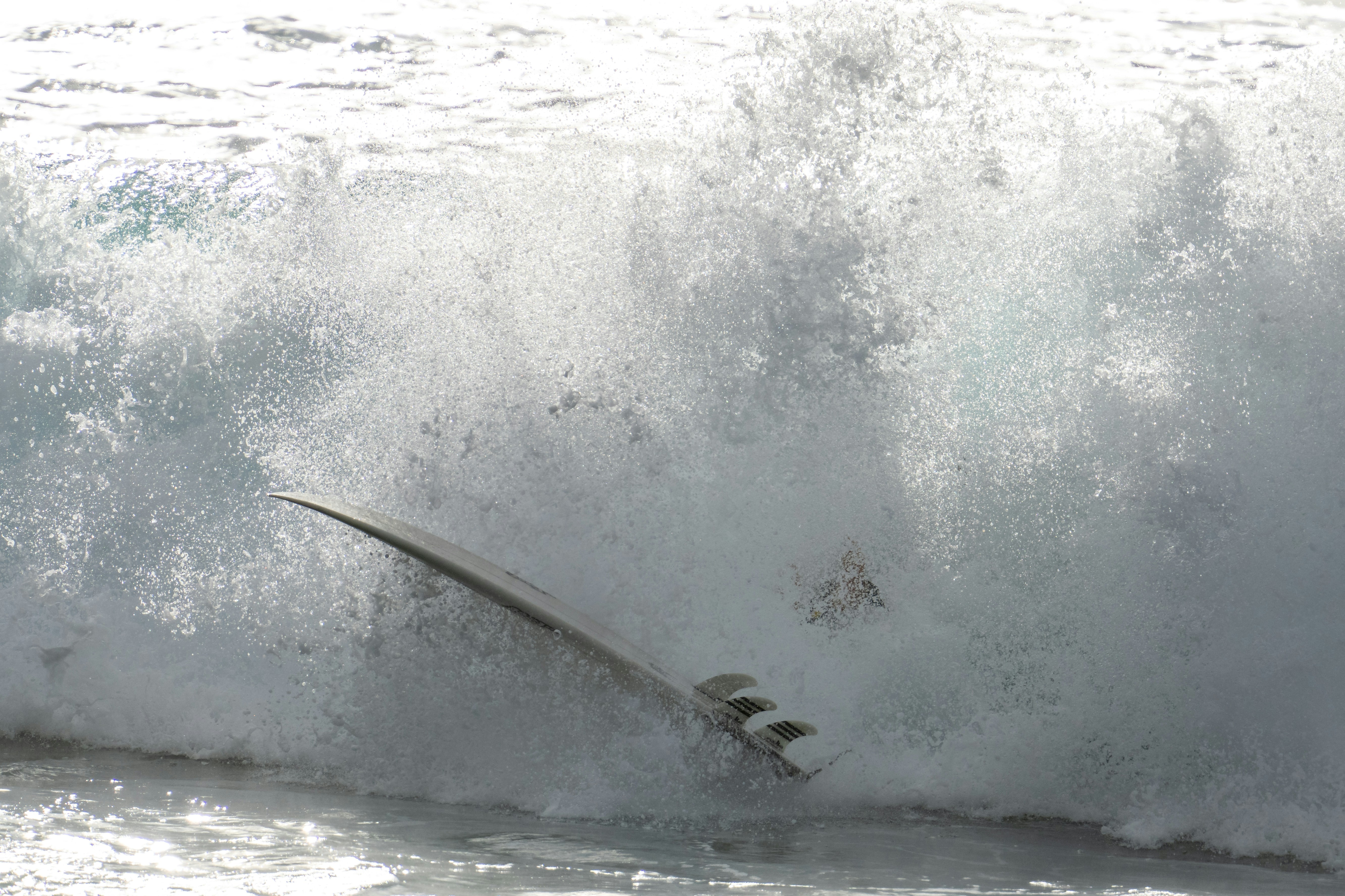 Caught in the Surge: A Surfer's Dance with the Ocean