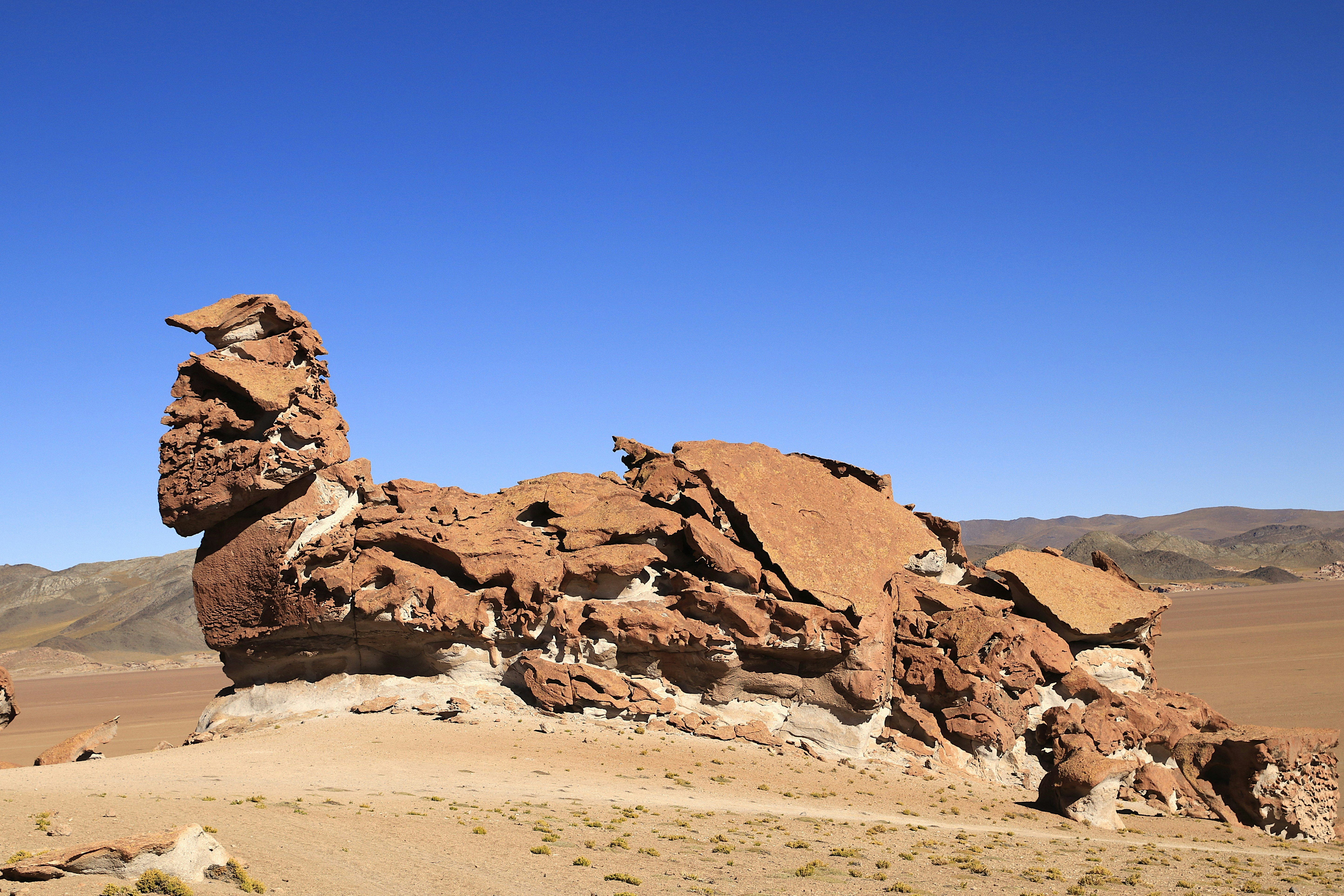 Road to El Volcan Galan | Sculpted rock formation in a desert landscape