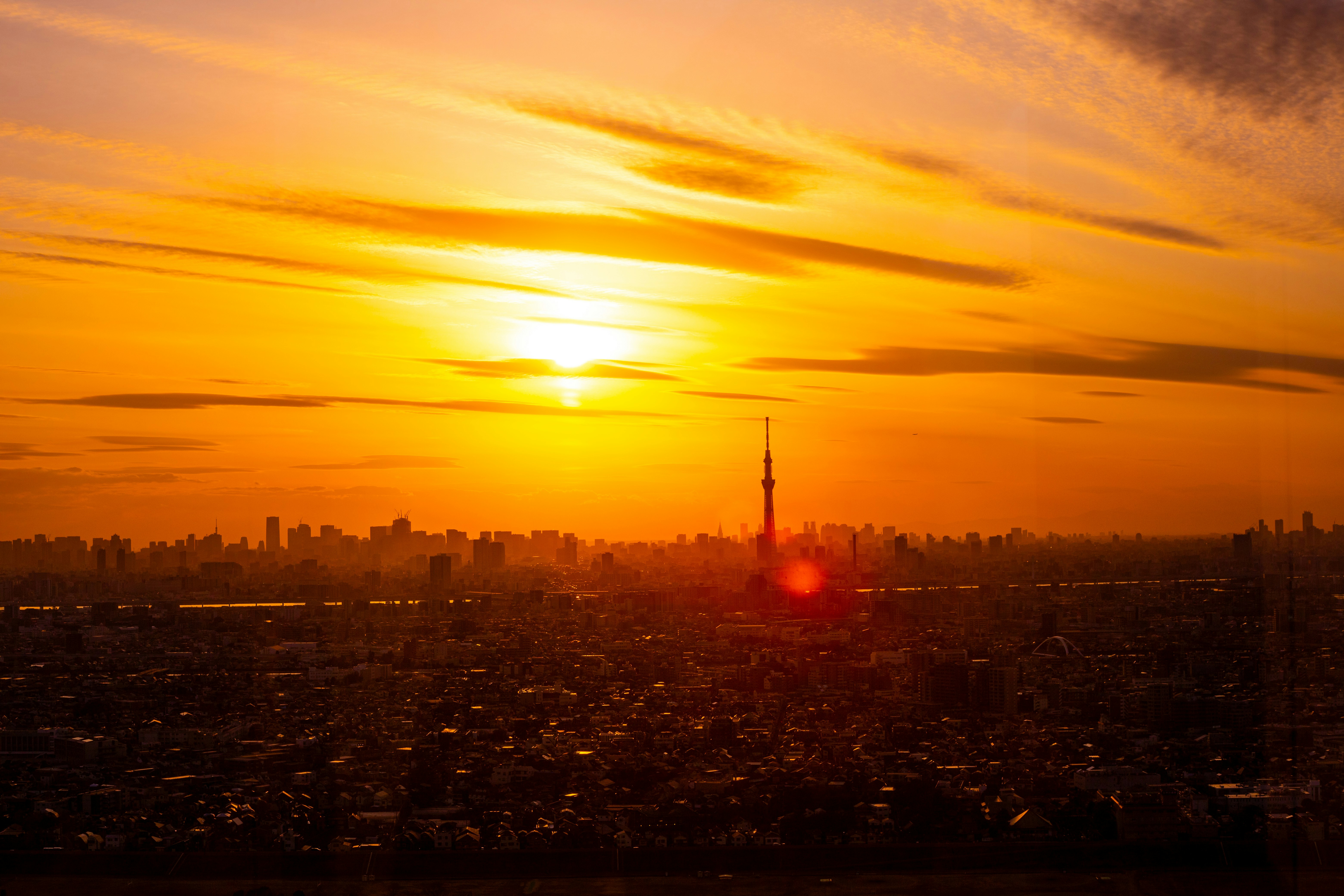 Golden sunset over a sprawling city skyline