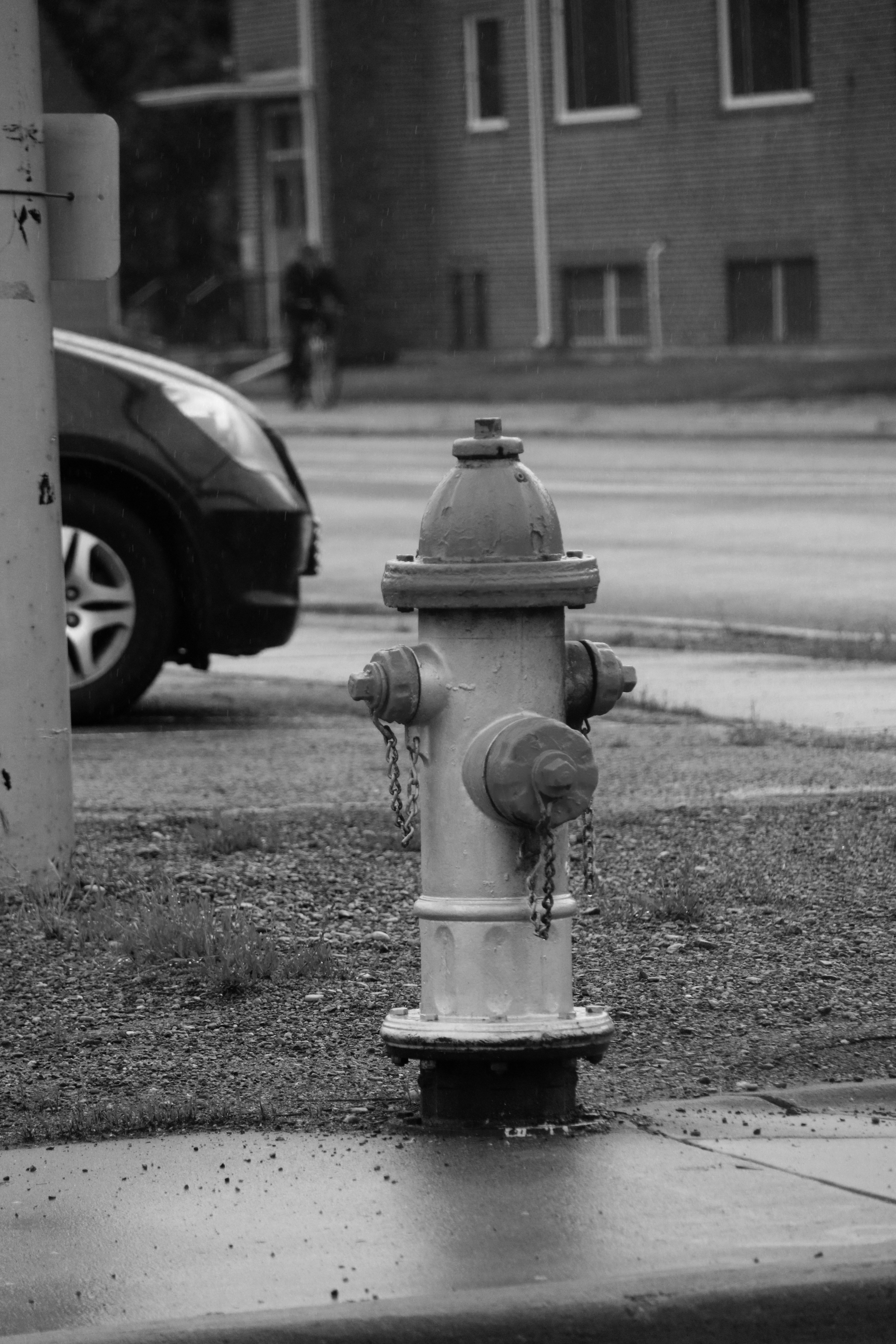 Fire Hydrant in billings MT | Fire hydrant on a wet sidewalk with car