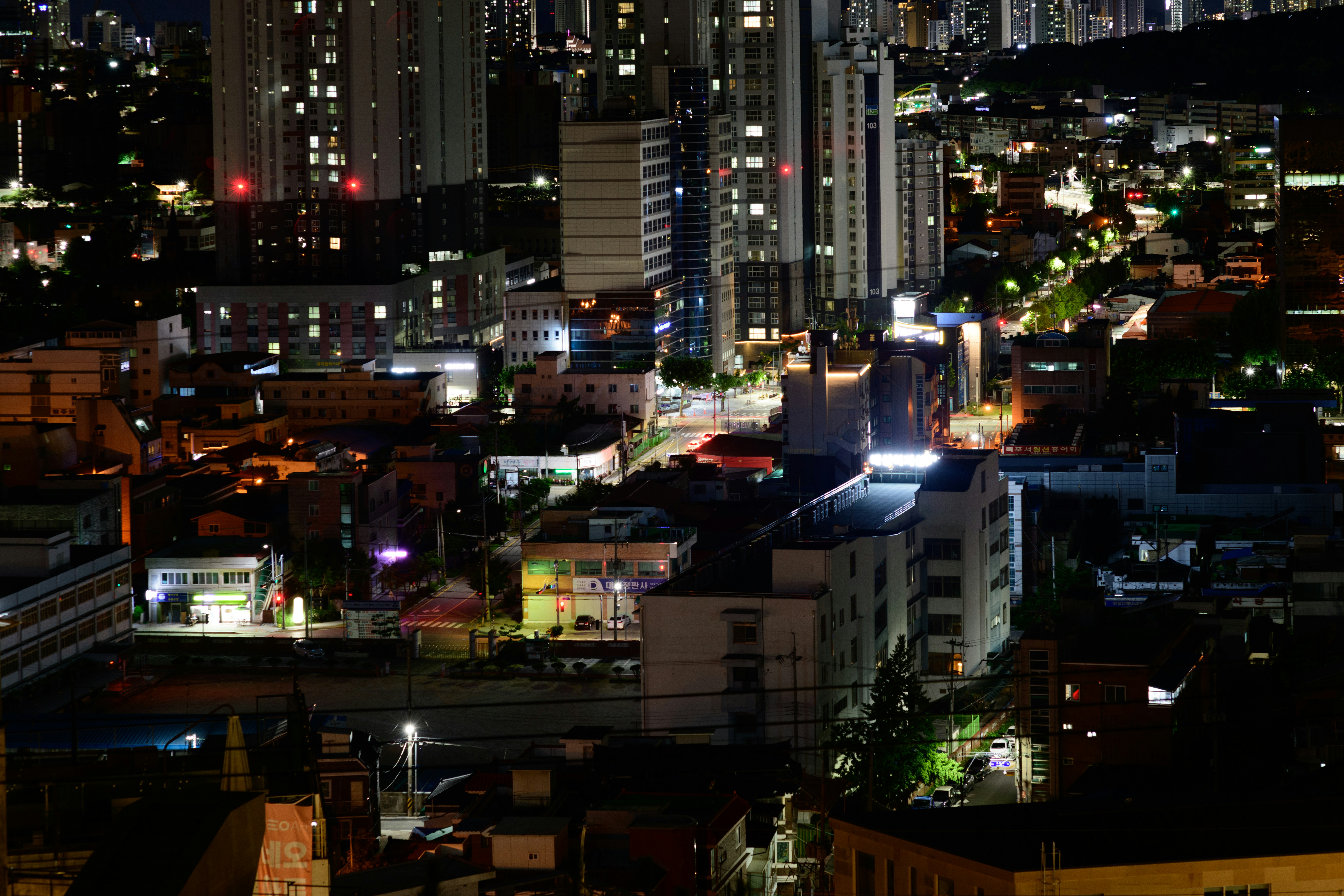 City skyline at night with illuminated buildings