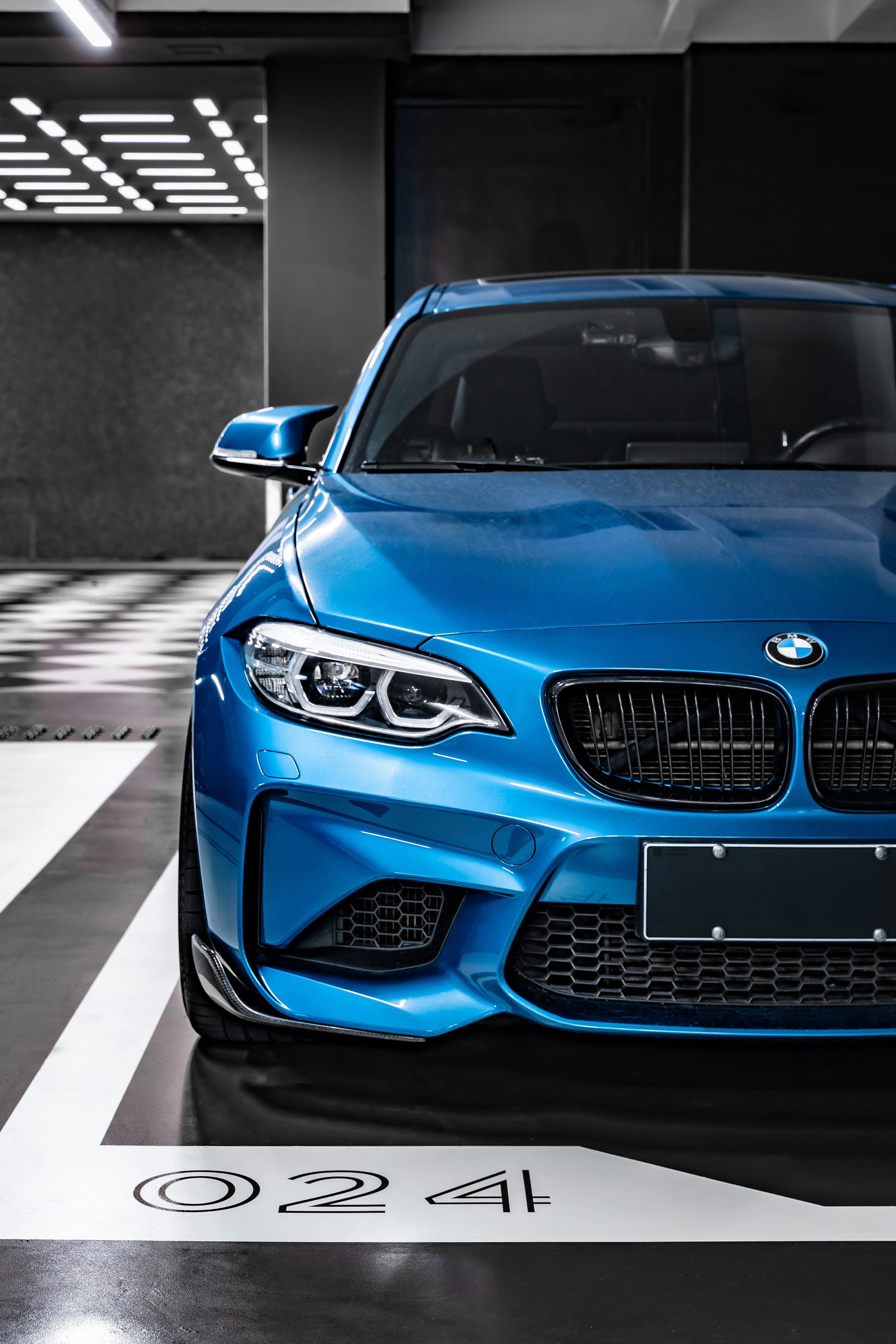 Long Beach Blue M2 | Blue BMW m2 parked in a garage