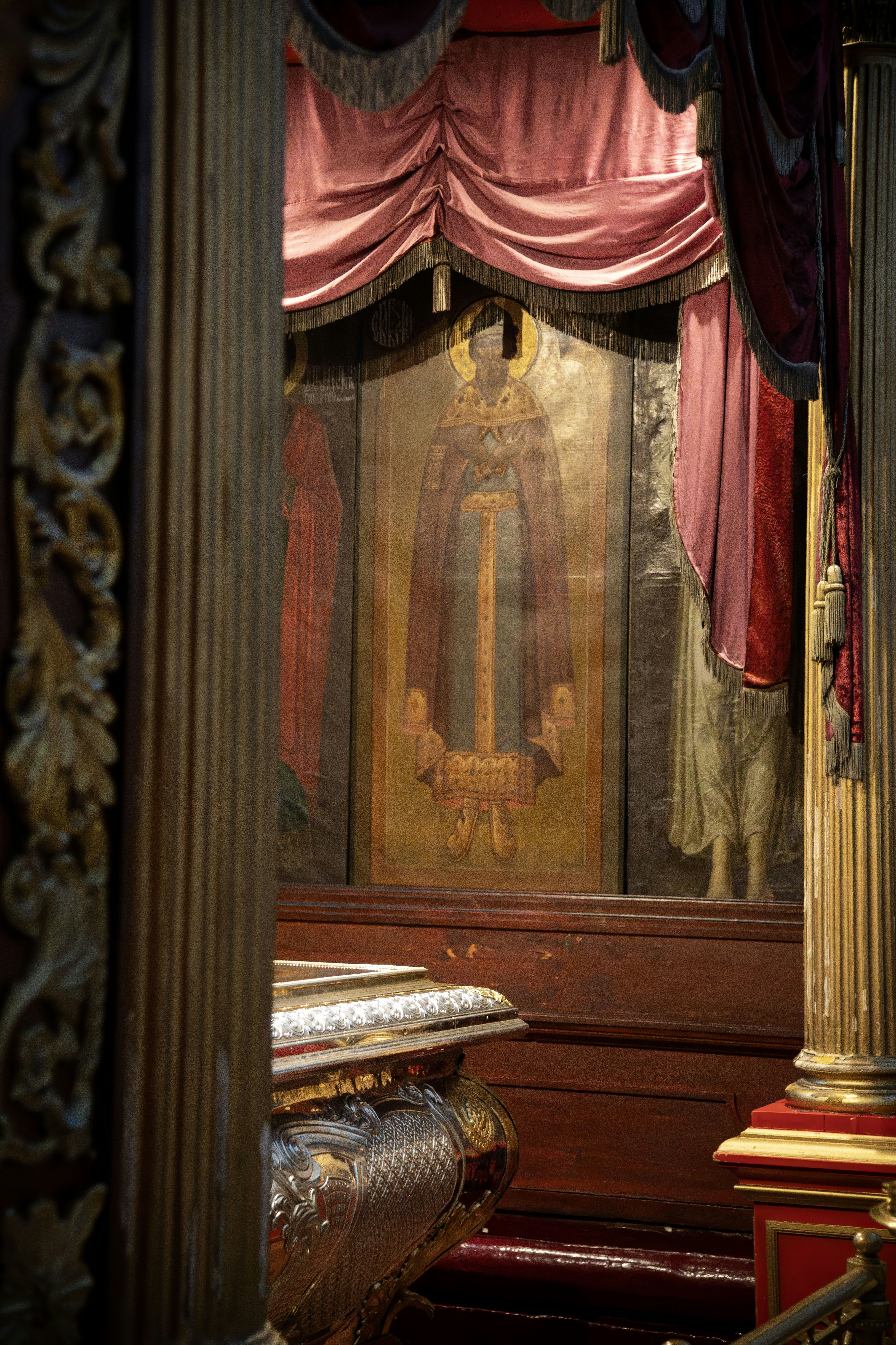 Pskov, Holy Trinity Cathedral | Iconostasis with draped curtains and ornate columns
