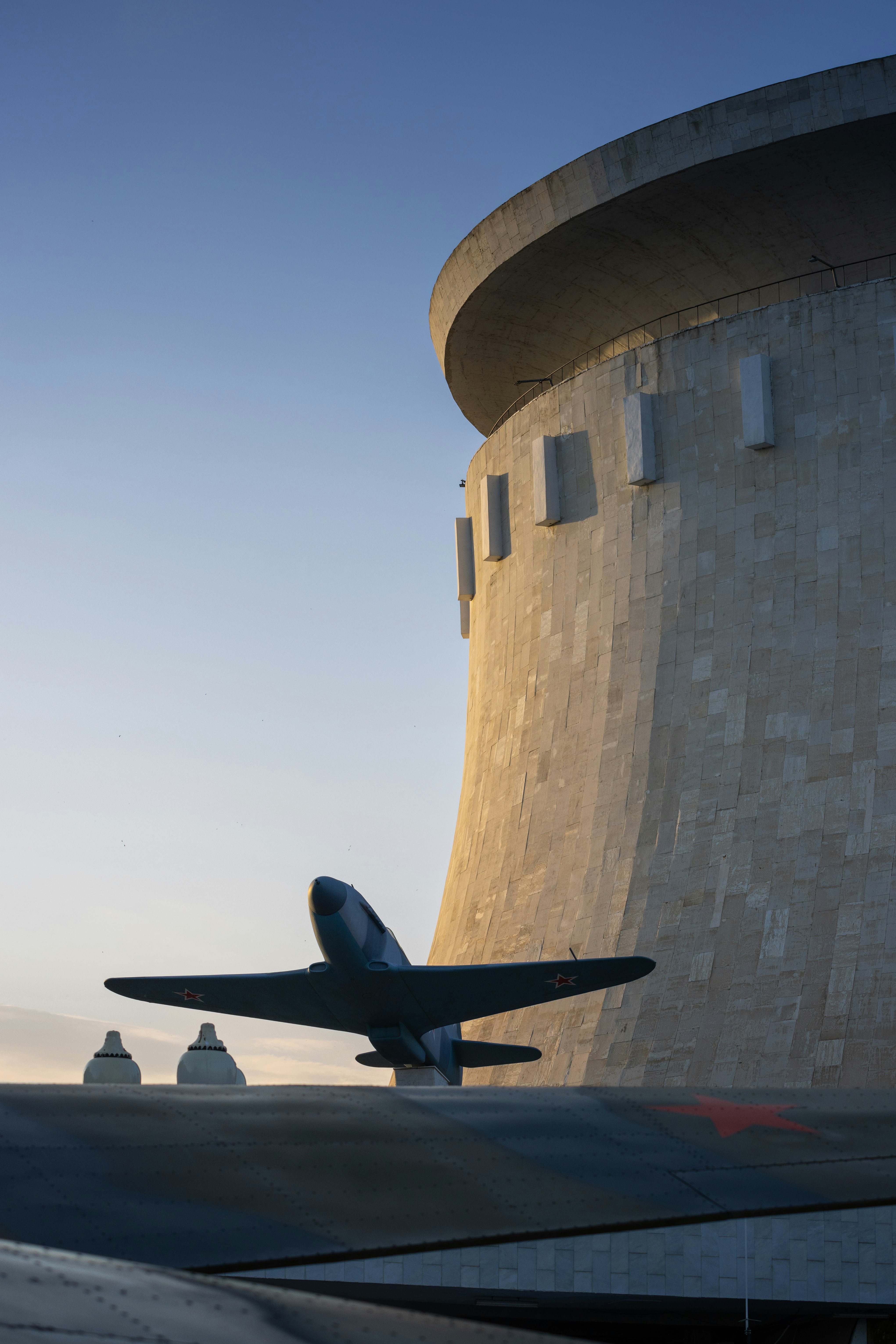 Jet on the Edge: A Low-Cruise Moment by the Curved Tower