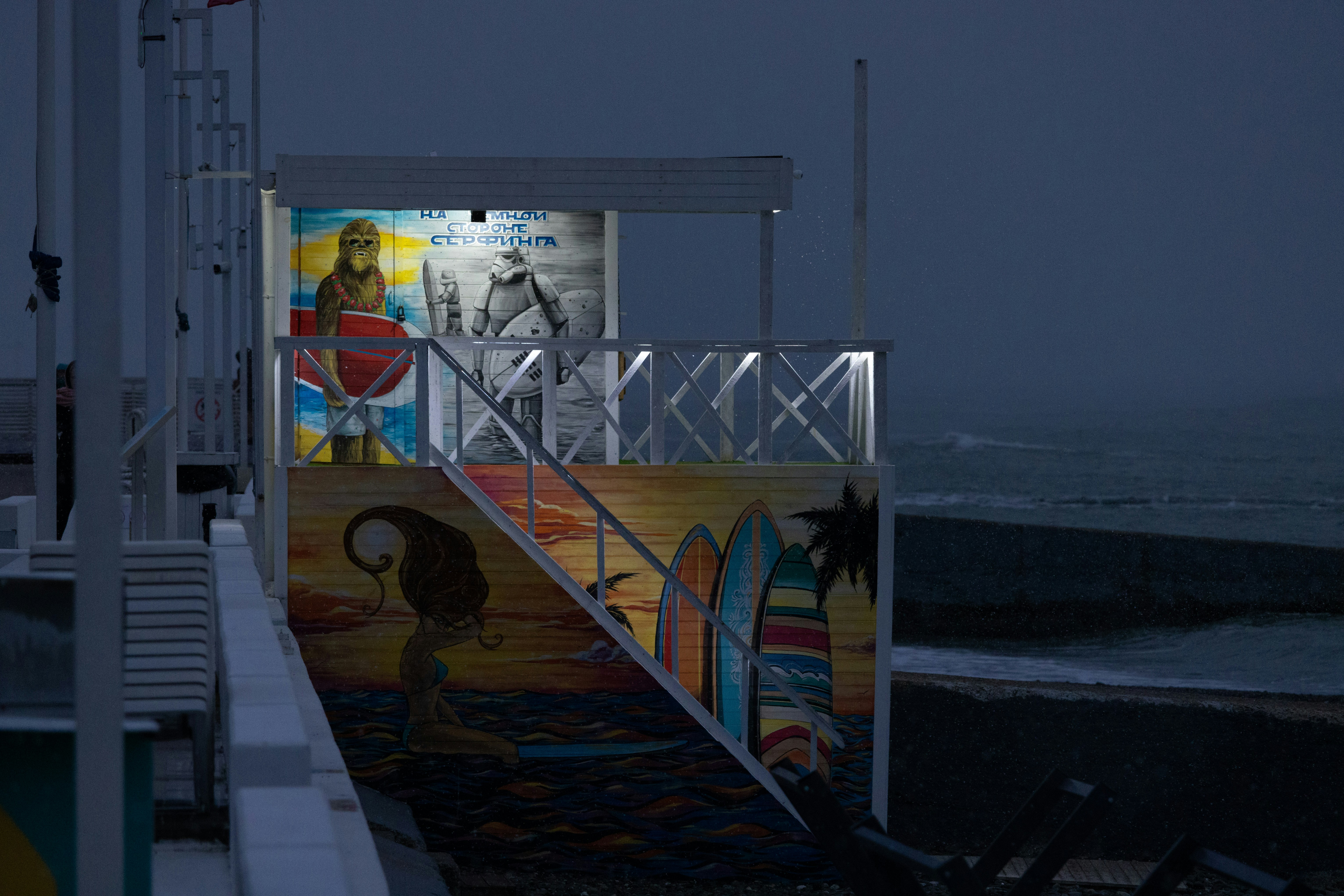 Illuminated Surf Haven Amidst the Storm