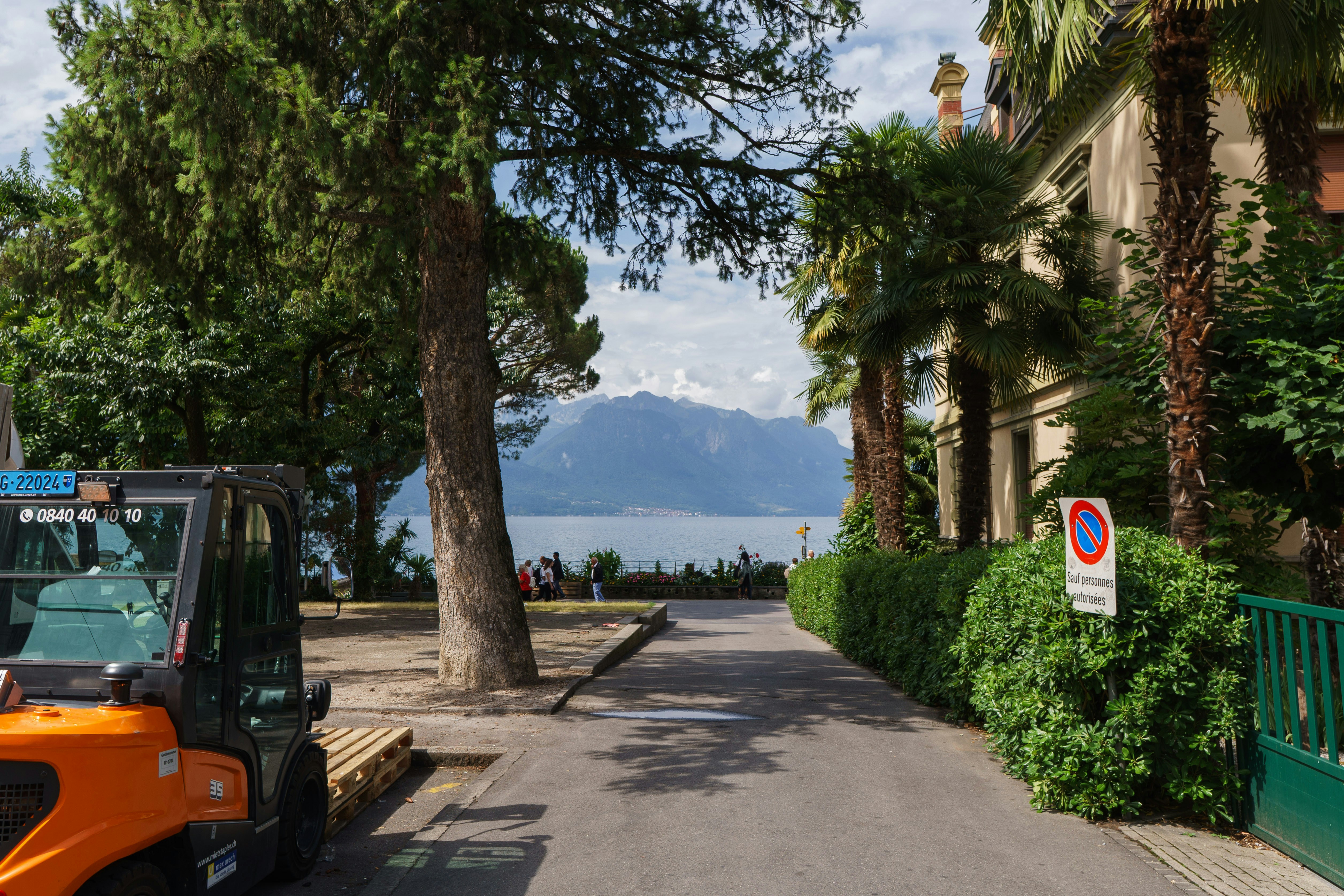 Road leading to a lake with distant mountains